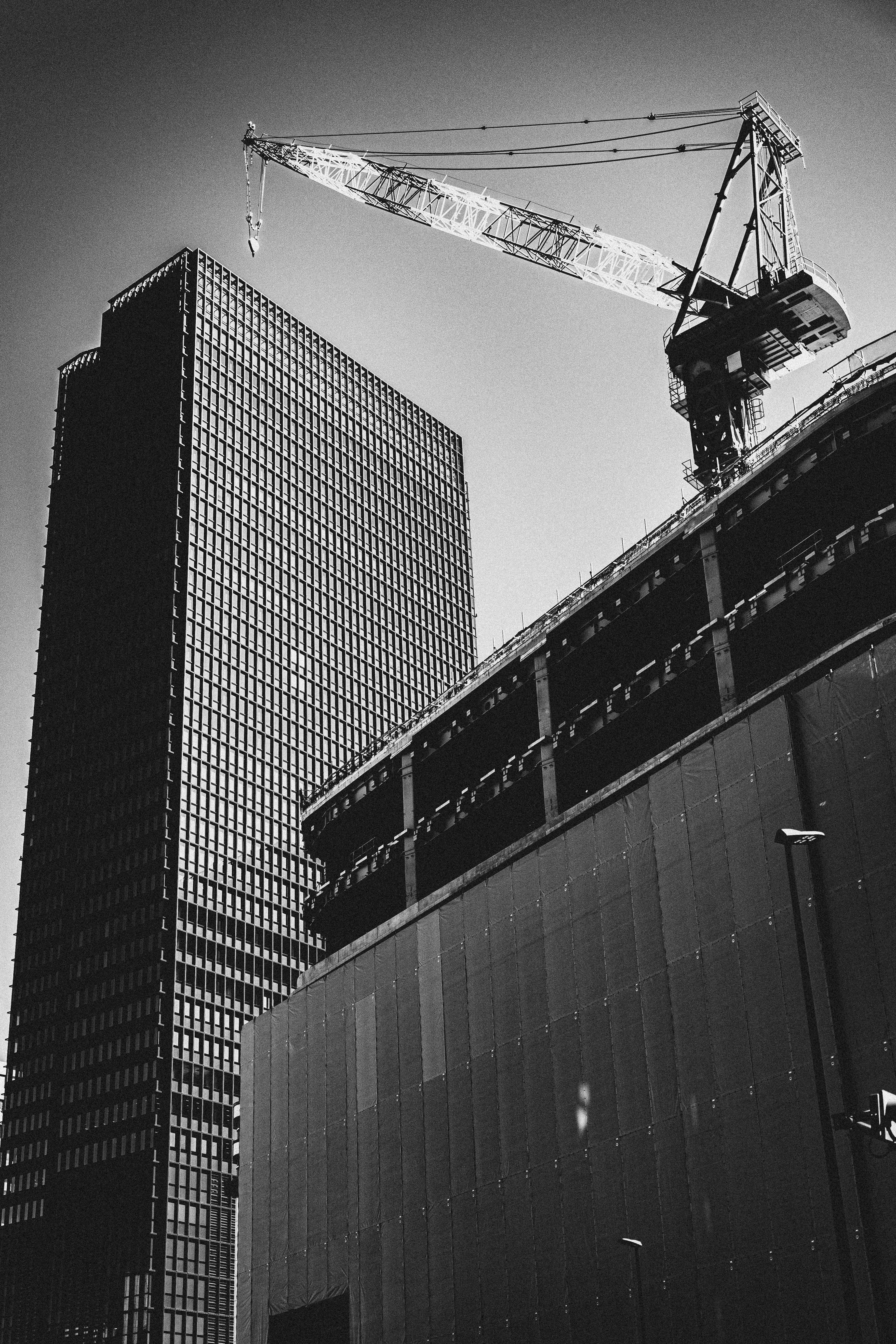 Crane Over Grid: A Monochrome City Rises