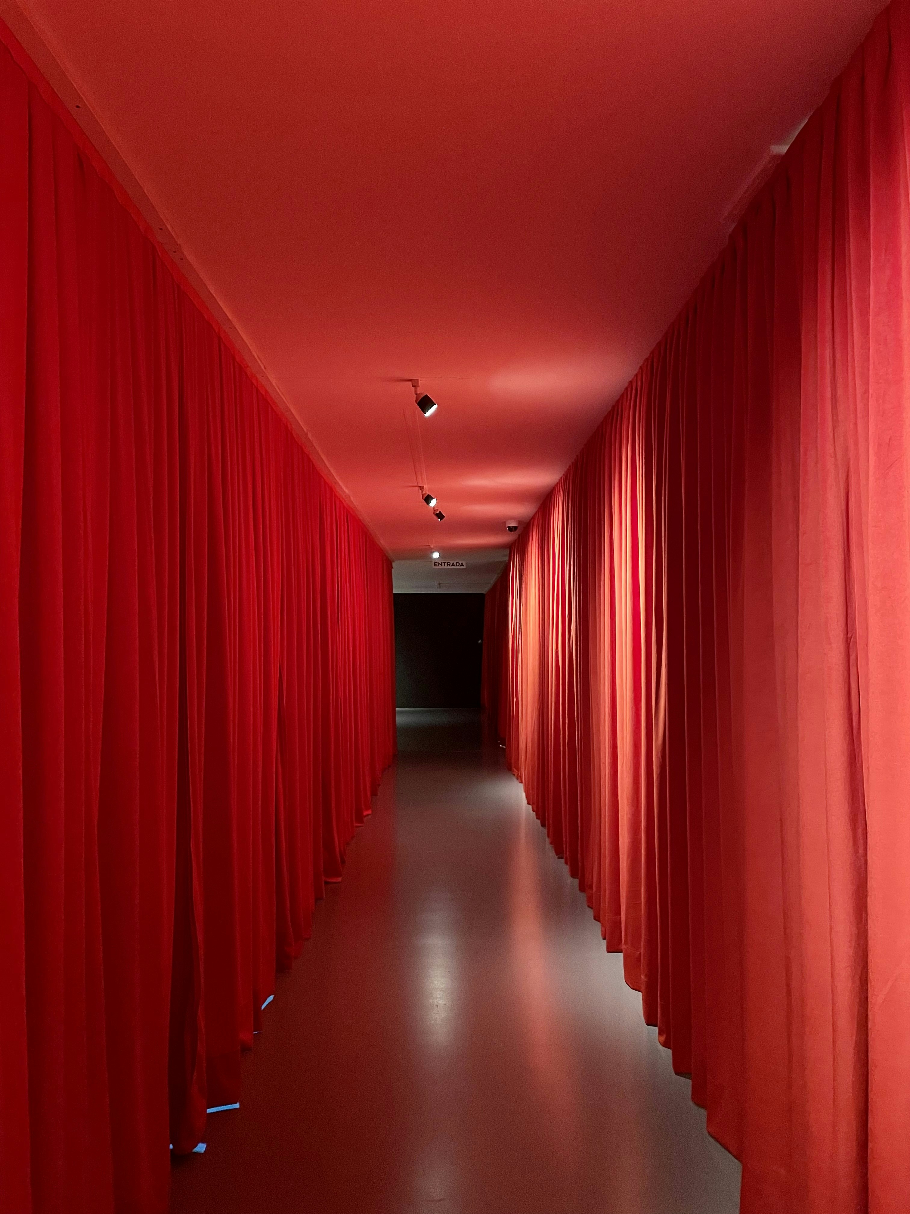 a hallway with red walls