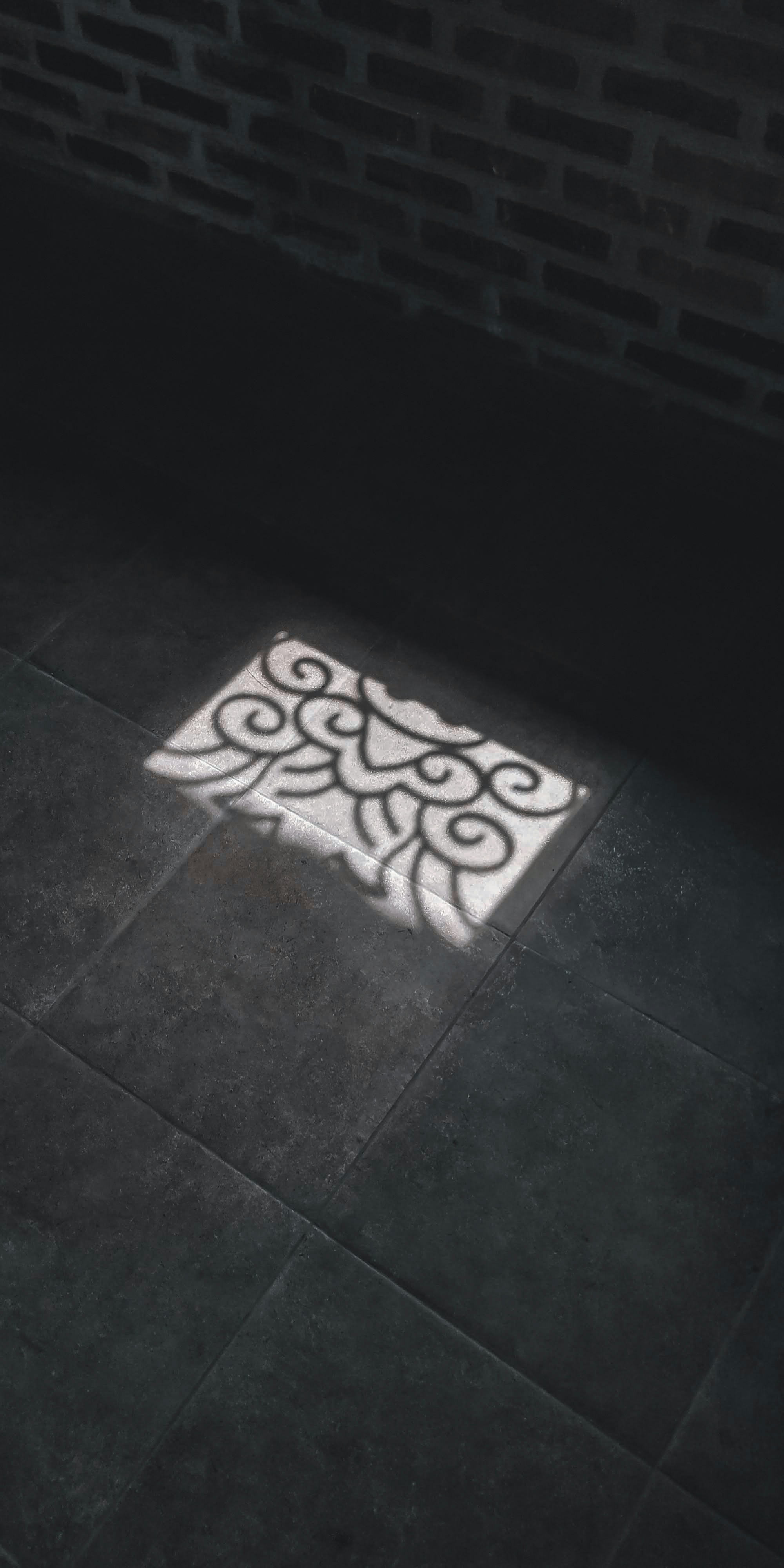 Shadowed Courtyard Tile with Decorative Light Pattern