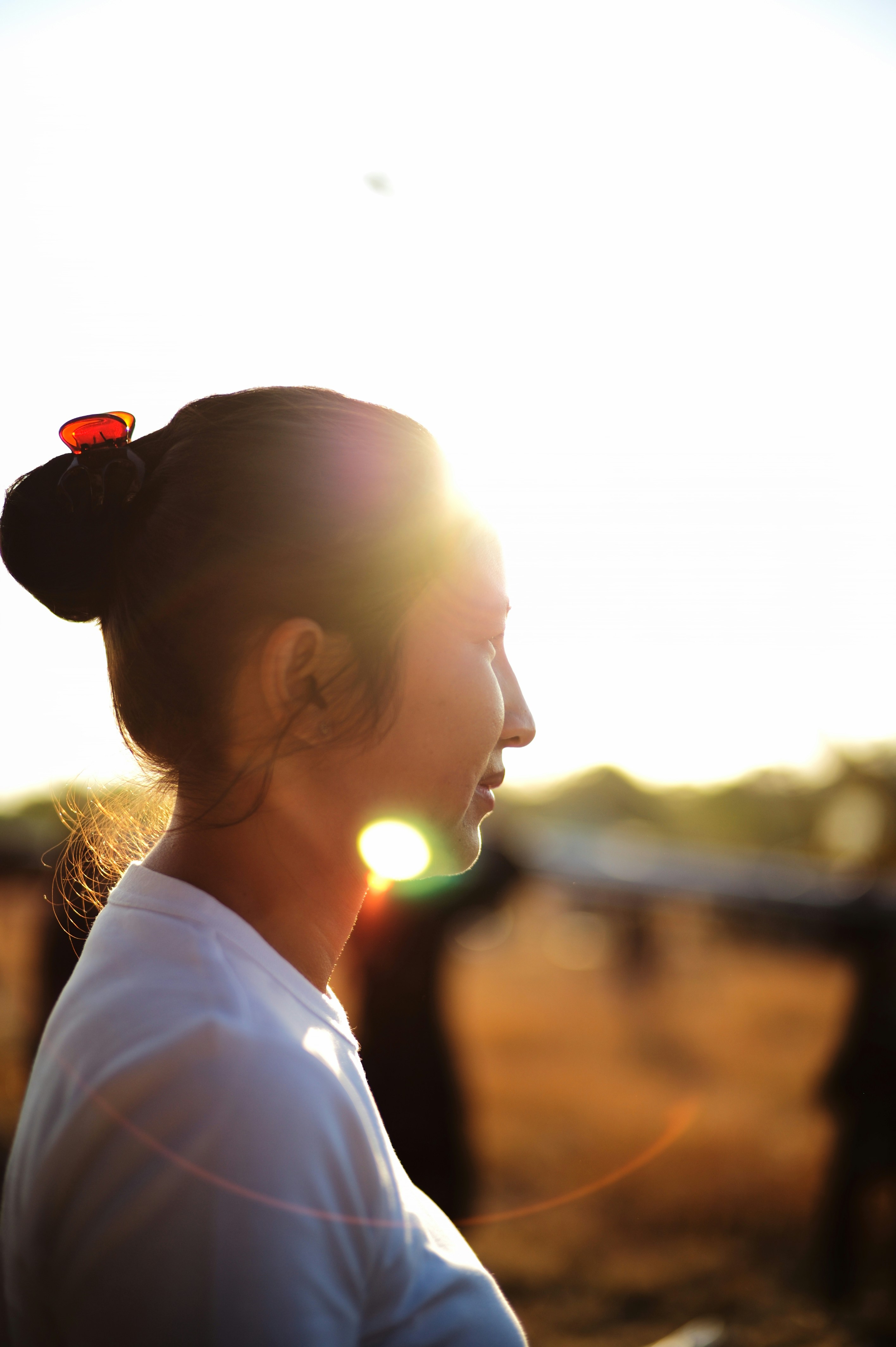 Backlit Profile: Sunflare Through a Quiet Evening Portrait