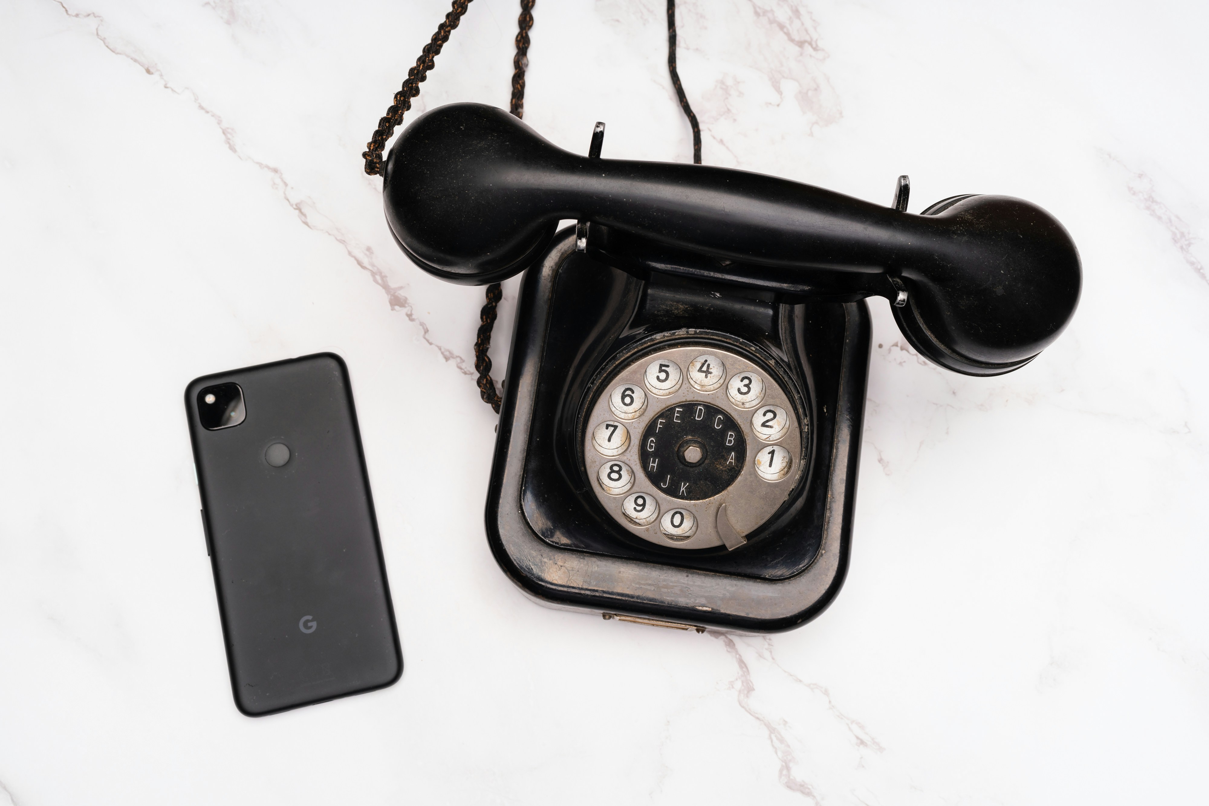 A black telephone with a cord photo – Free Phone Image on Unsplash