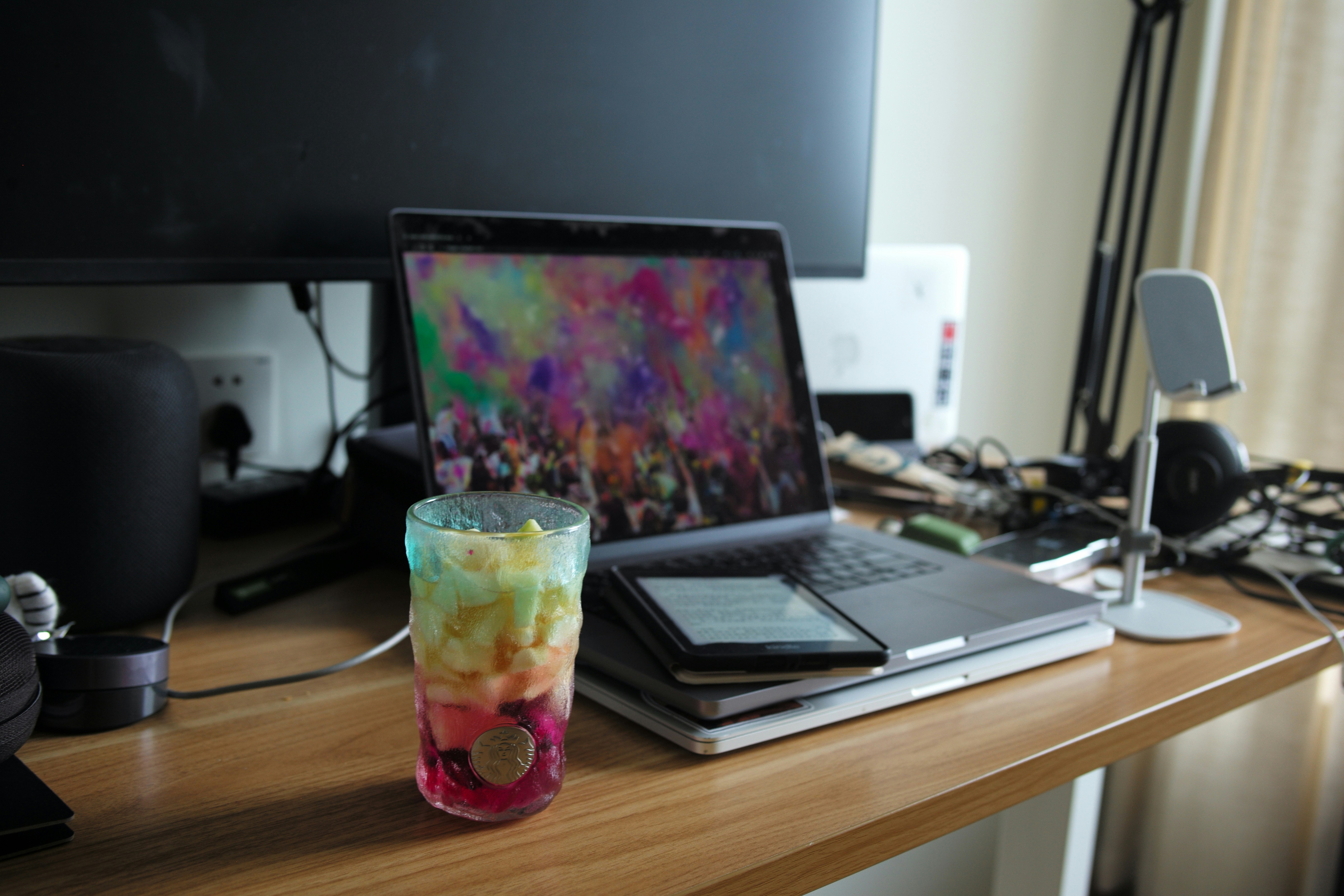 A glass of juice sits on a desk next to a laptop photo – Free Computer ...