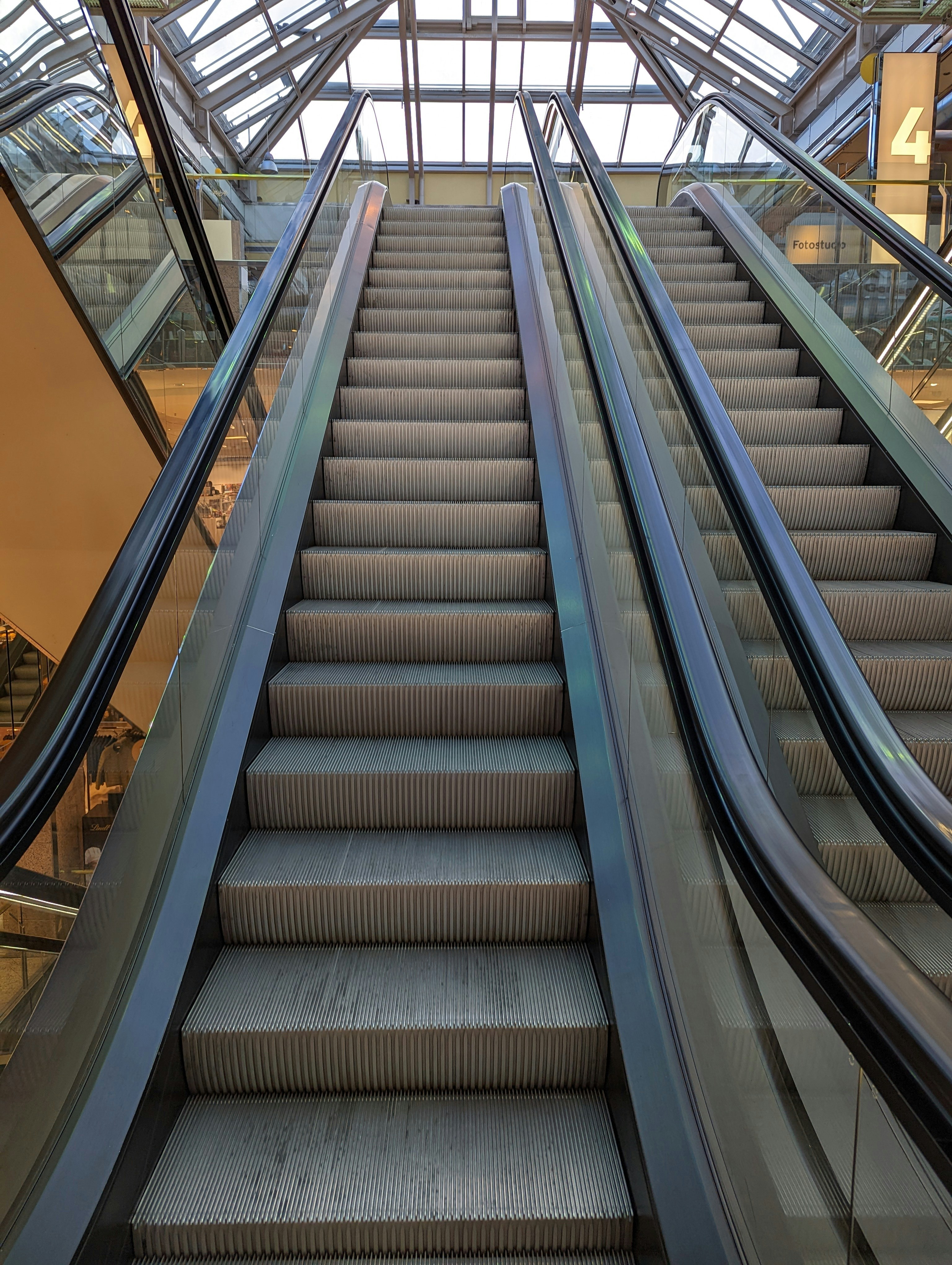 Toward the Glass Sky: Converging Escalators in an Atrium