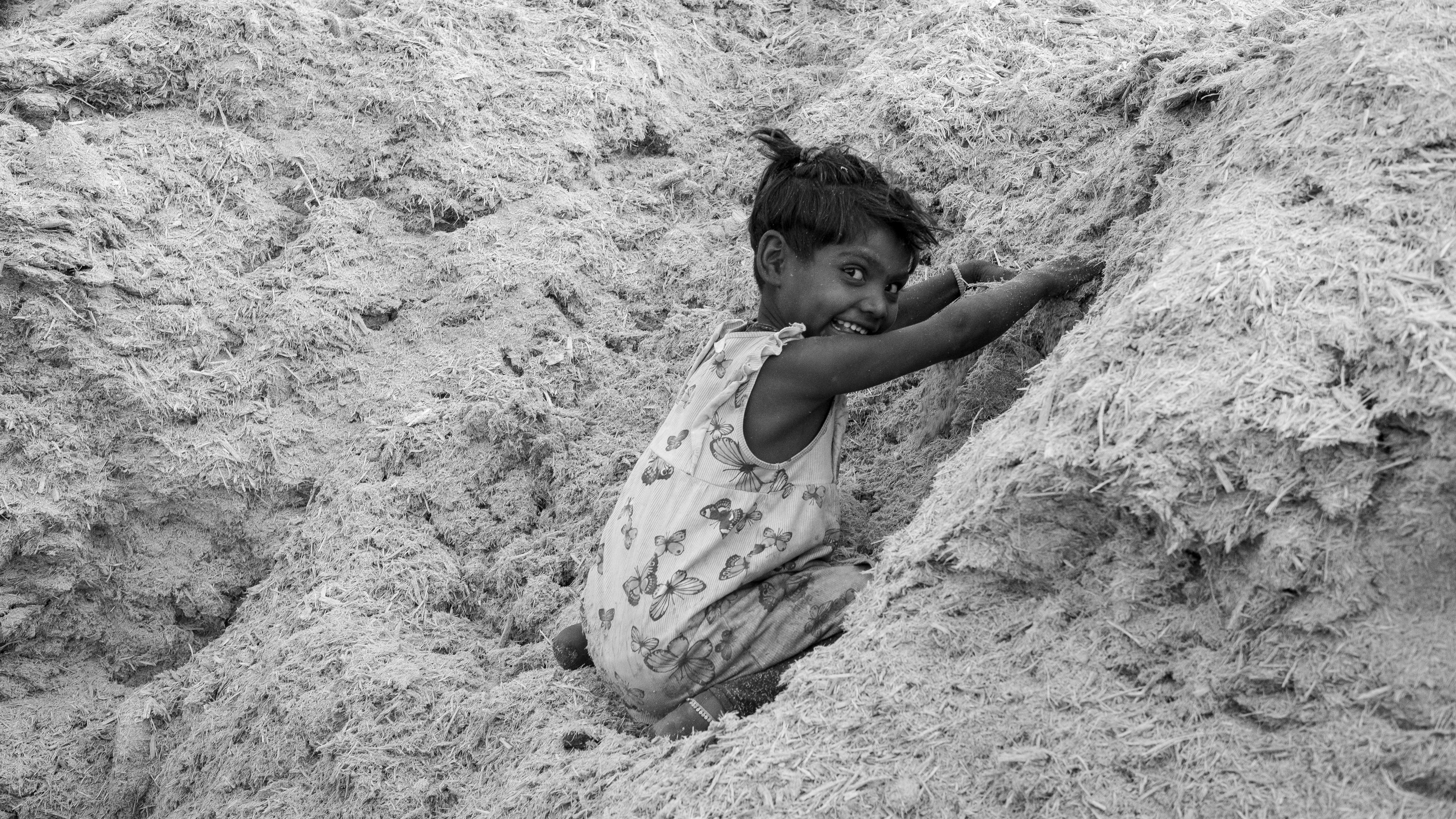 A child playing in the sand photo – Free Unicef Image on Unsplash