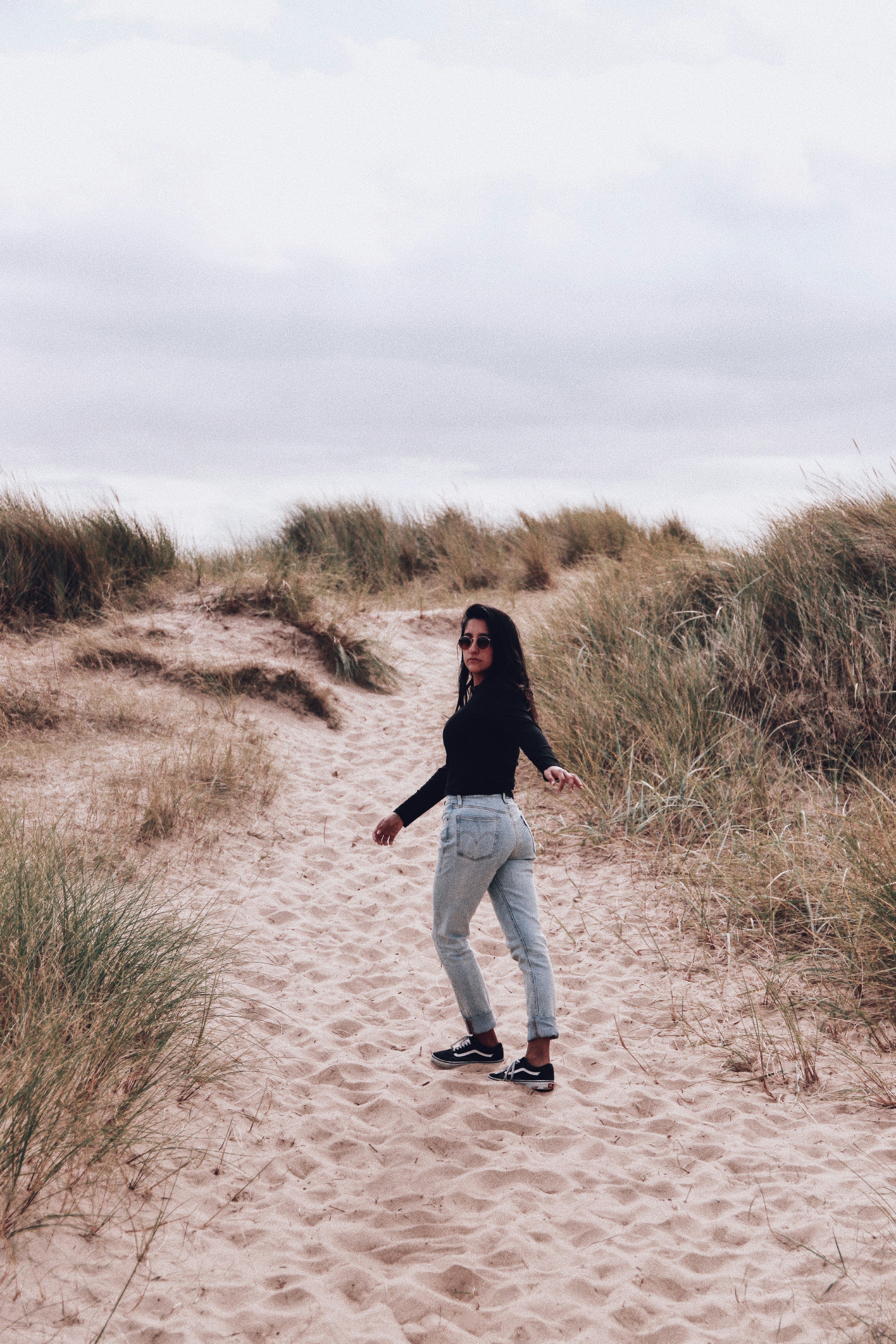 a man standing on a sandy beach