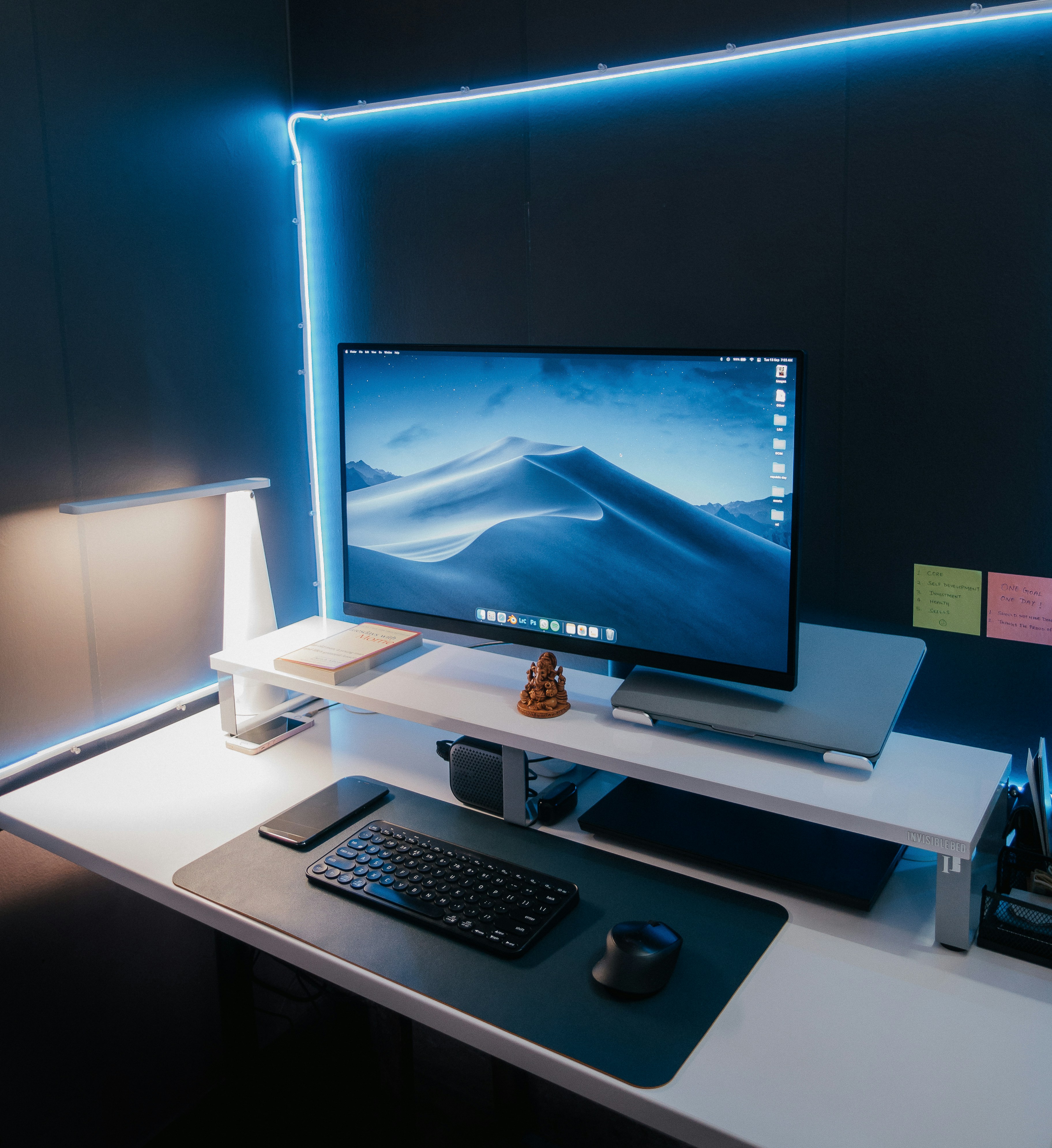 A computer on a desk photo – Free Blue Image on Unsplash