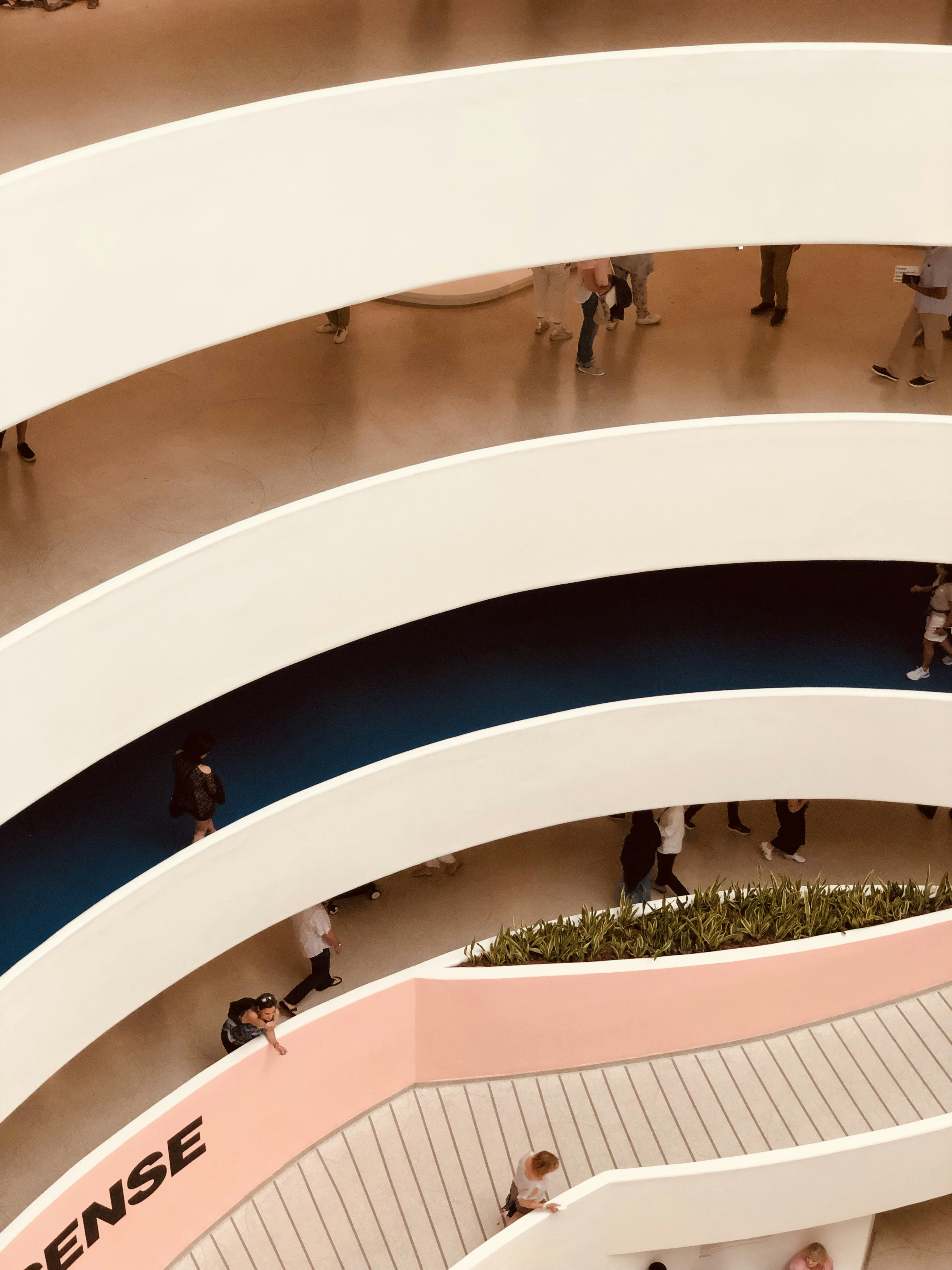 a group of people walking on a walkway