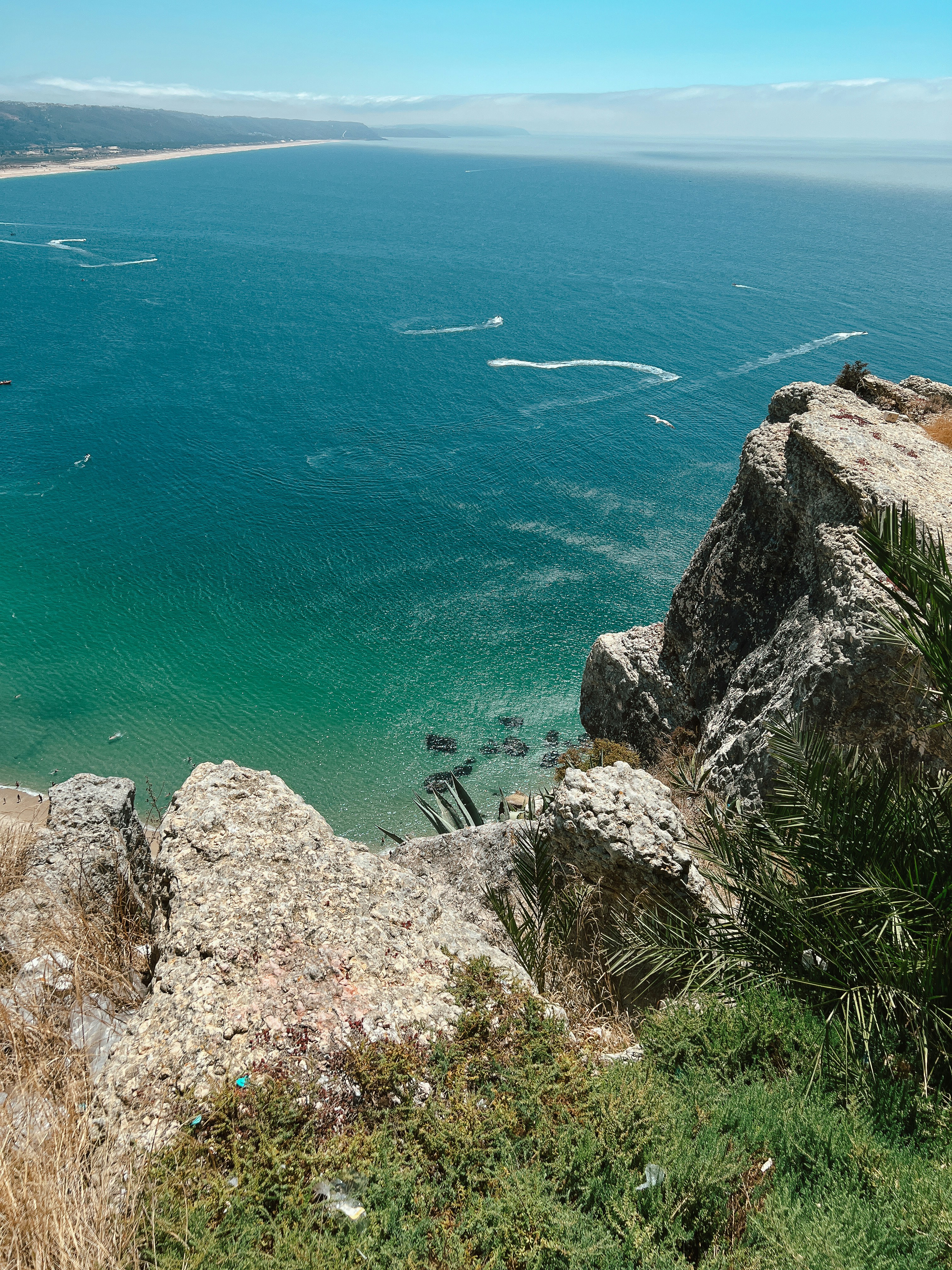A cliff side with a body of water below photo – Free Portugal Image on ...