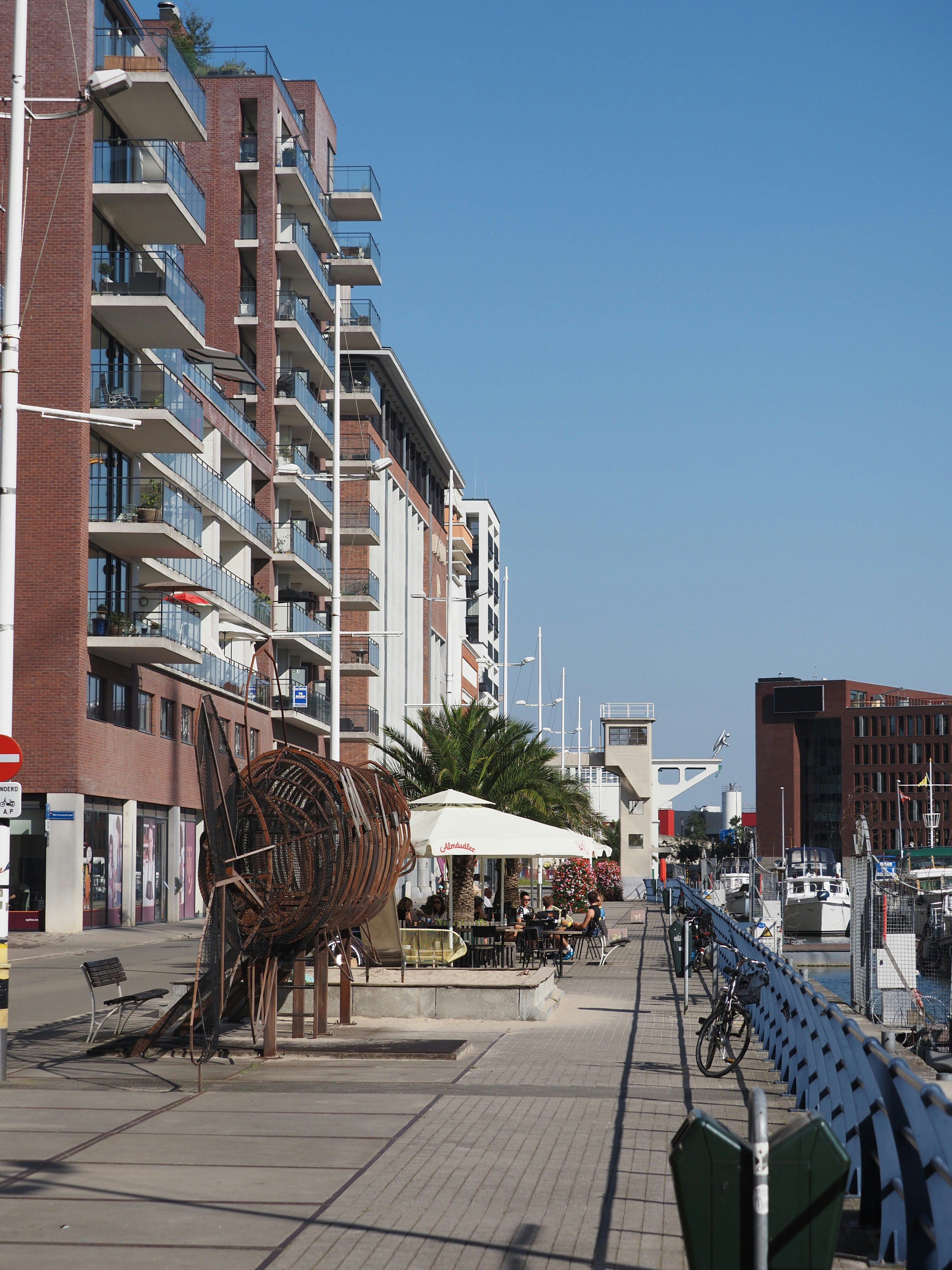 Harbor Promenade with Modern Apartments and Marina Boats