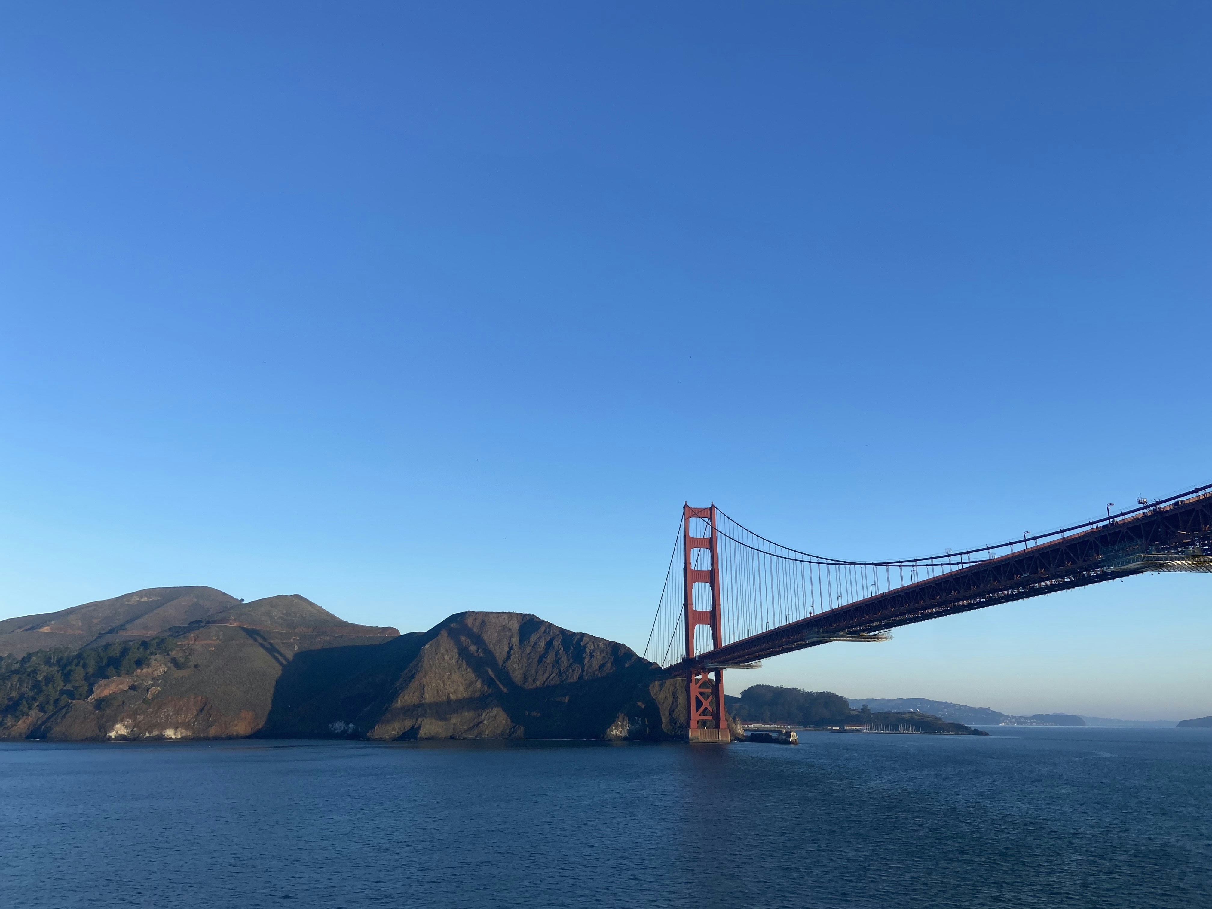 A large red bridge over water photo – Free Building Image on Unsplash