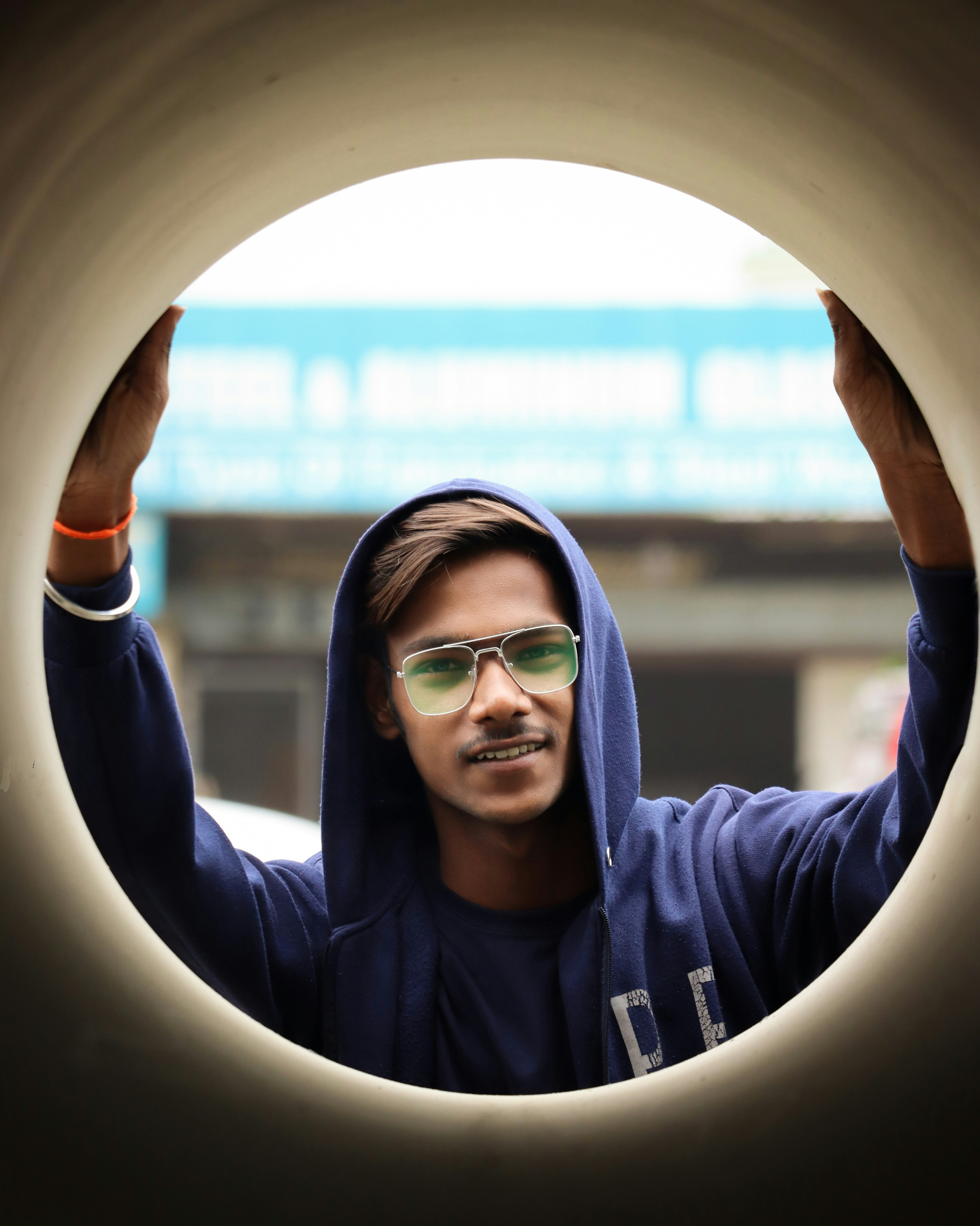 Through the Circular Frame: Hooded Portrait in Soft Focus