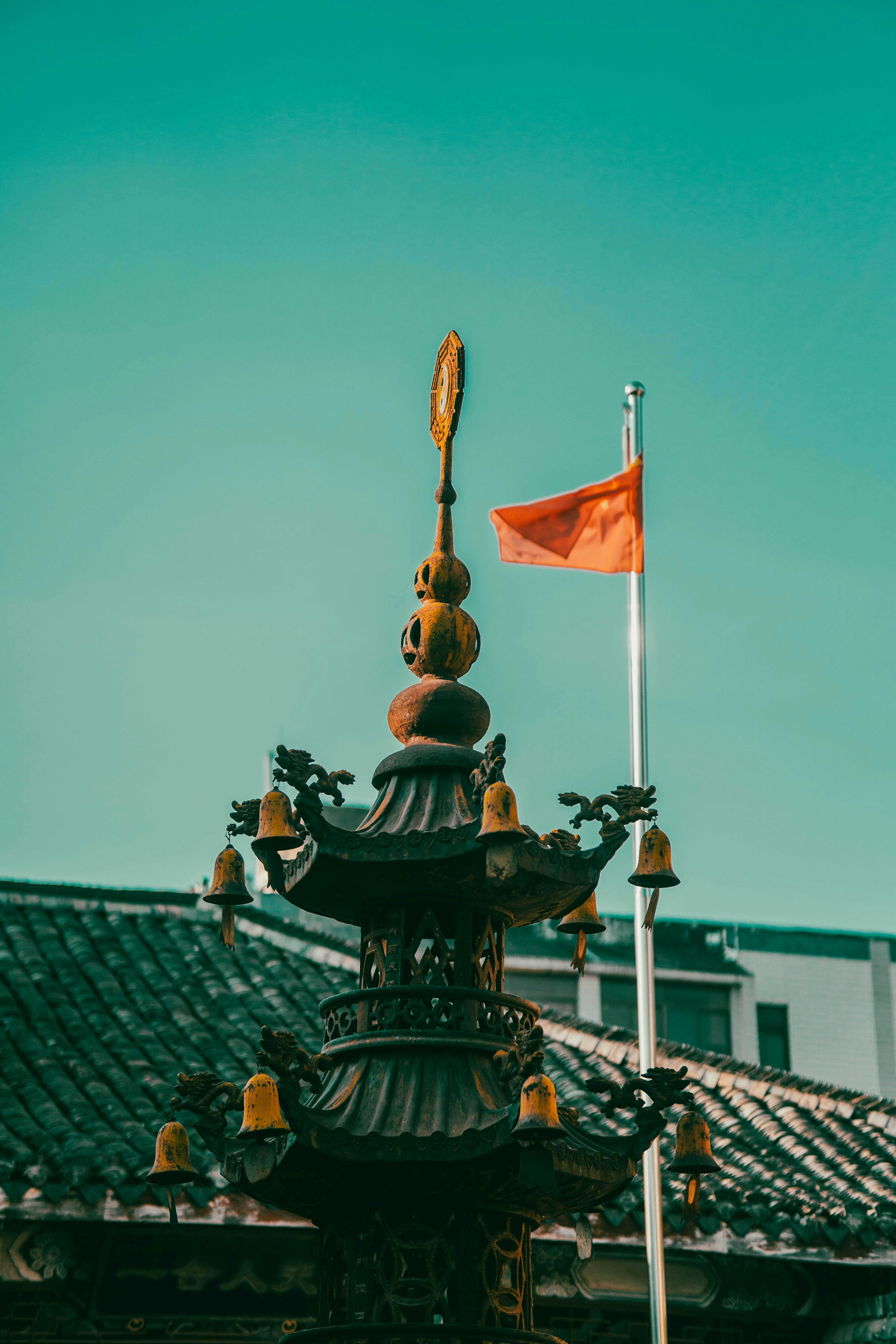 Tiered Pagoda Finial Under a Turquoise Sky