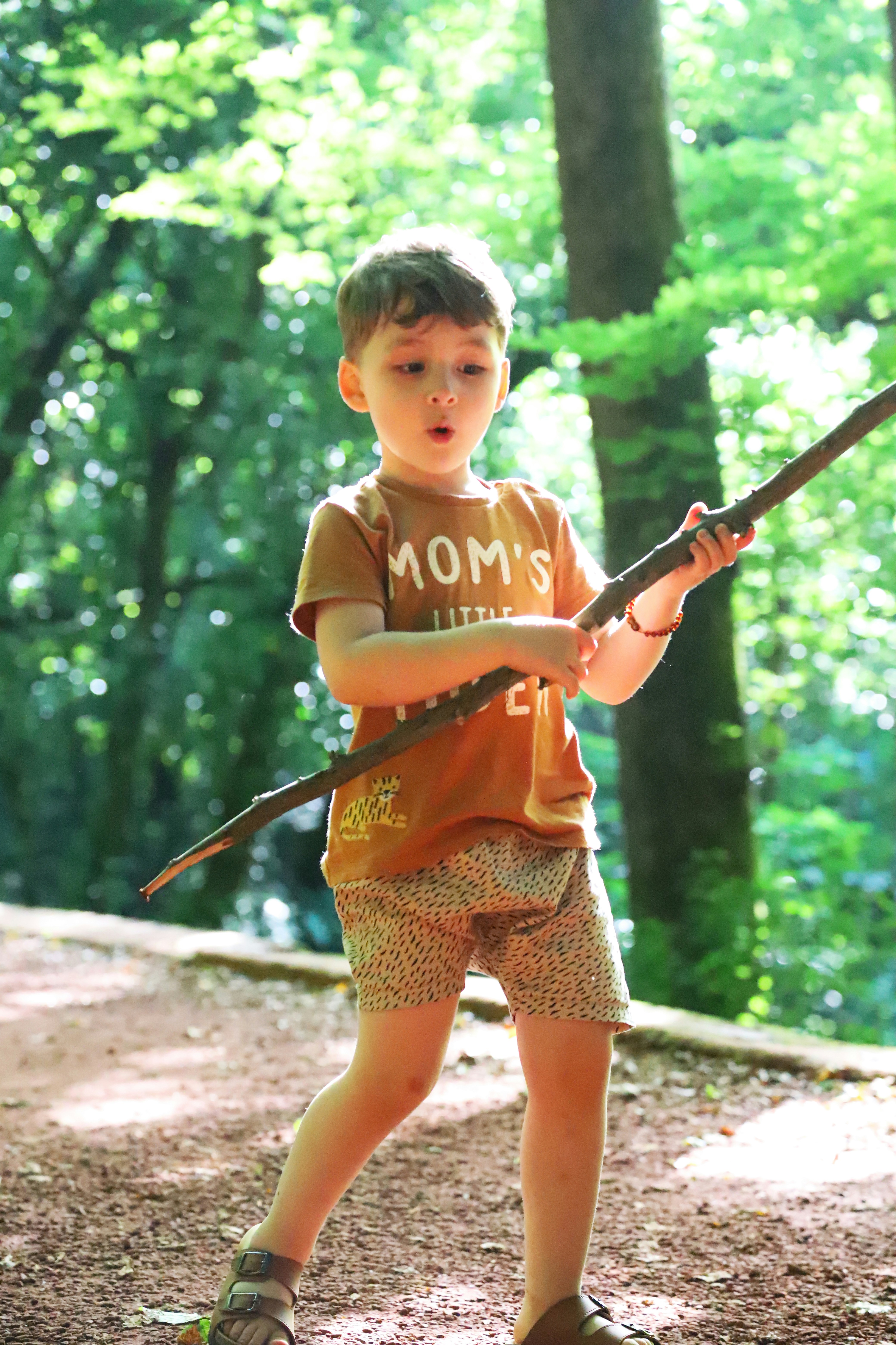A boy holding a baseball bat photo – Free Kid playing guitar Image on ...