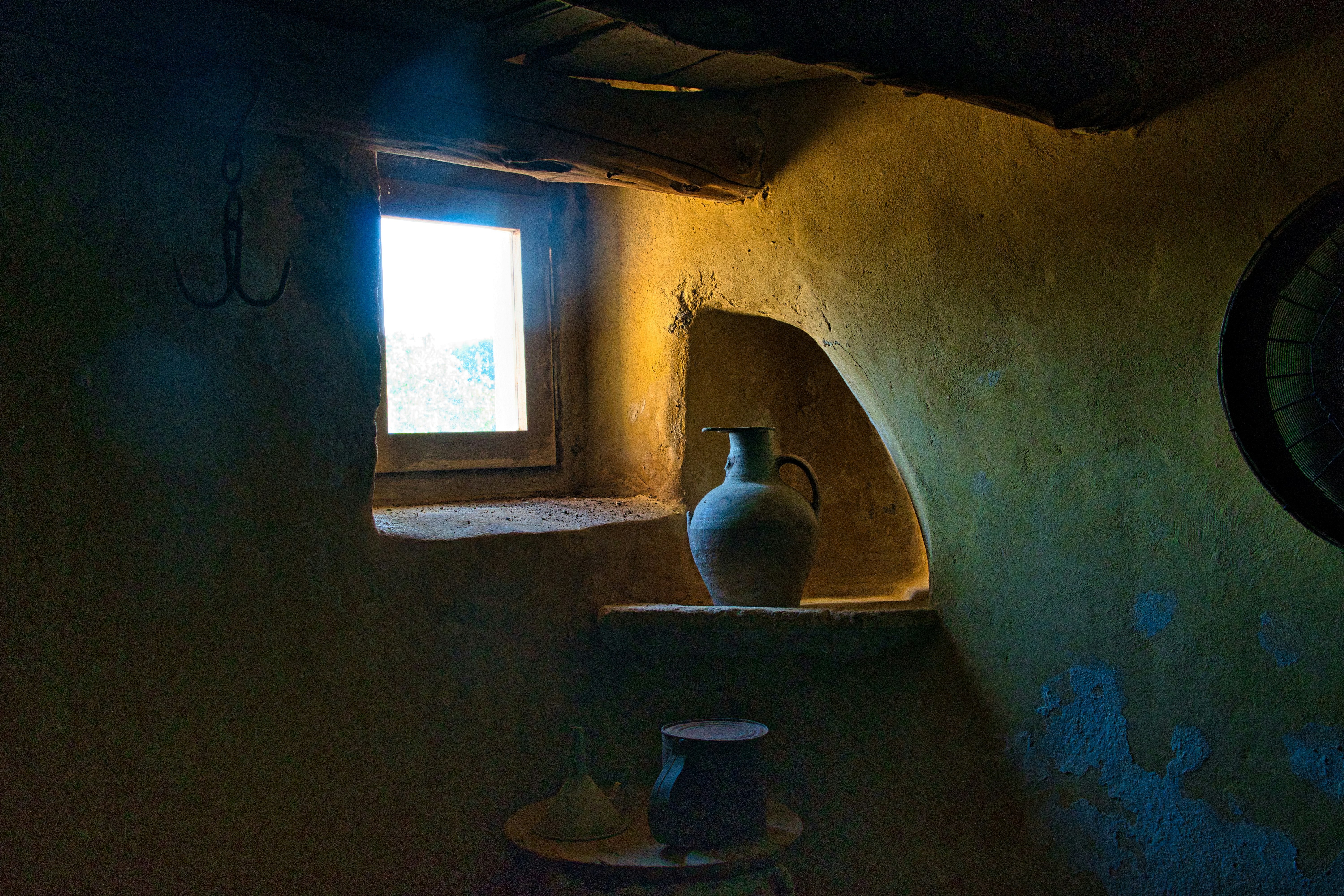 Window Light and a Lone Vase in a Quiet, Textured Interior