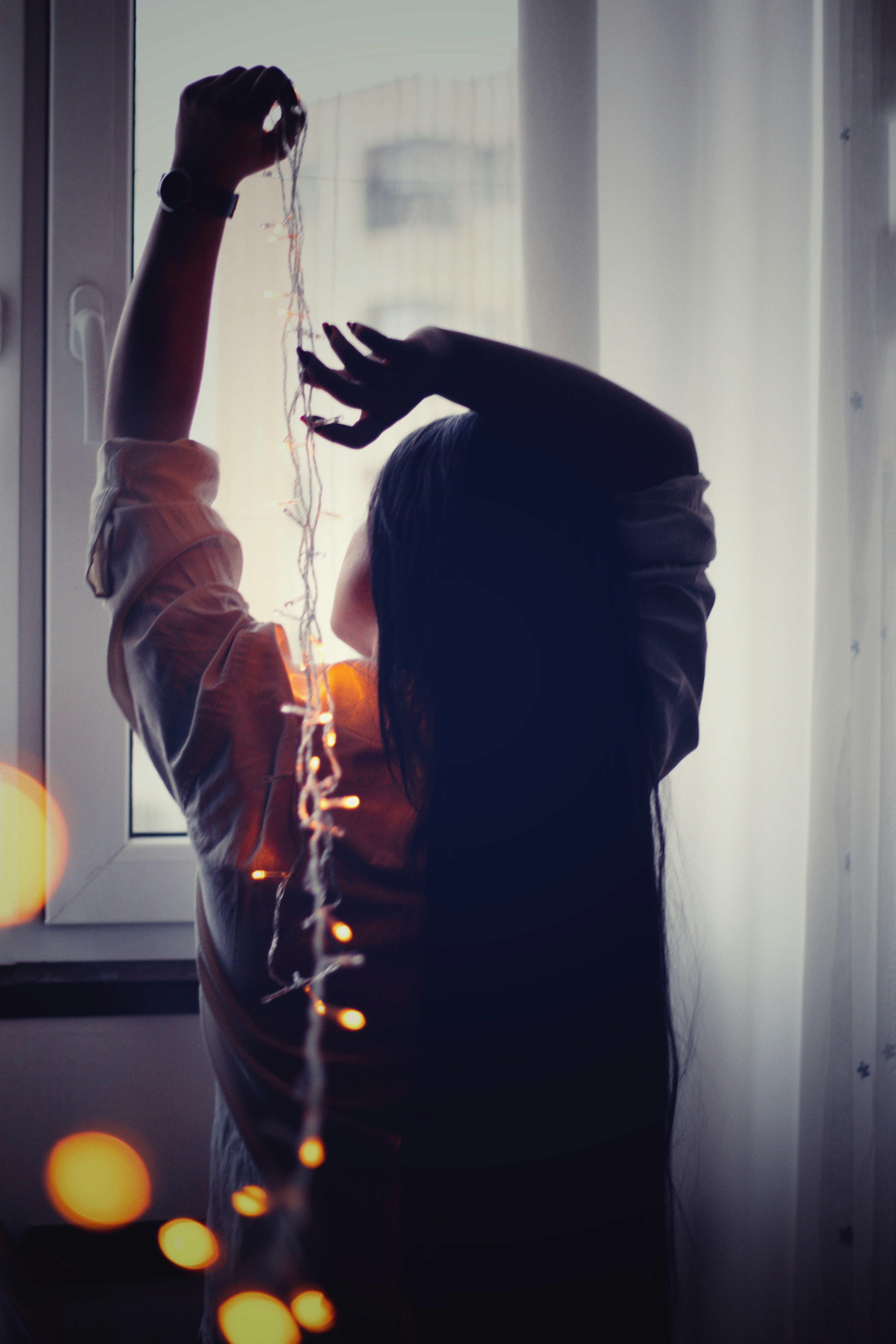 Window Light and Fairy Lights: A Quiet Portrait in Soft Focus