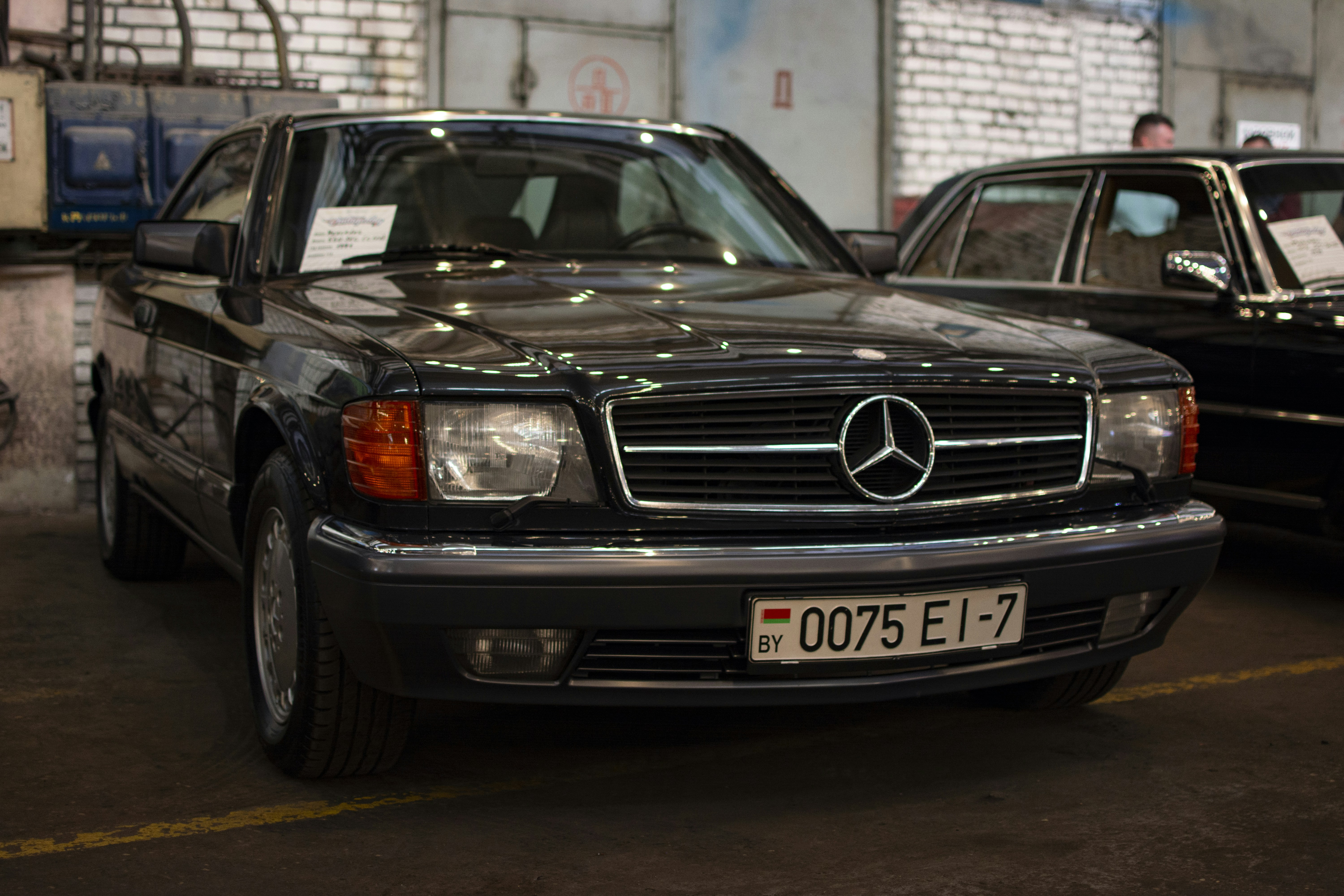 Chrome Gatekeeper: A Vintage Mercedes Emerges in an Industrial Warehouse