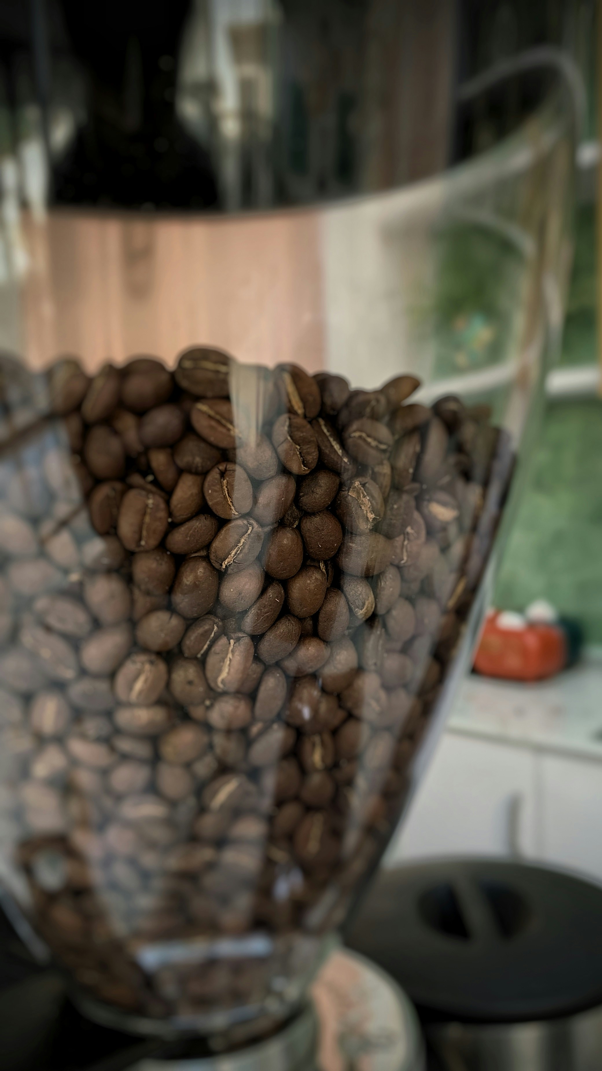 Glass Jar Macro: Close-Up of Rich Coffee Beans in a Grinder