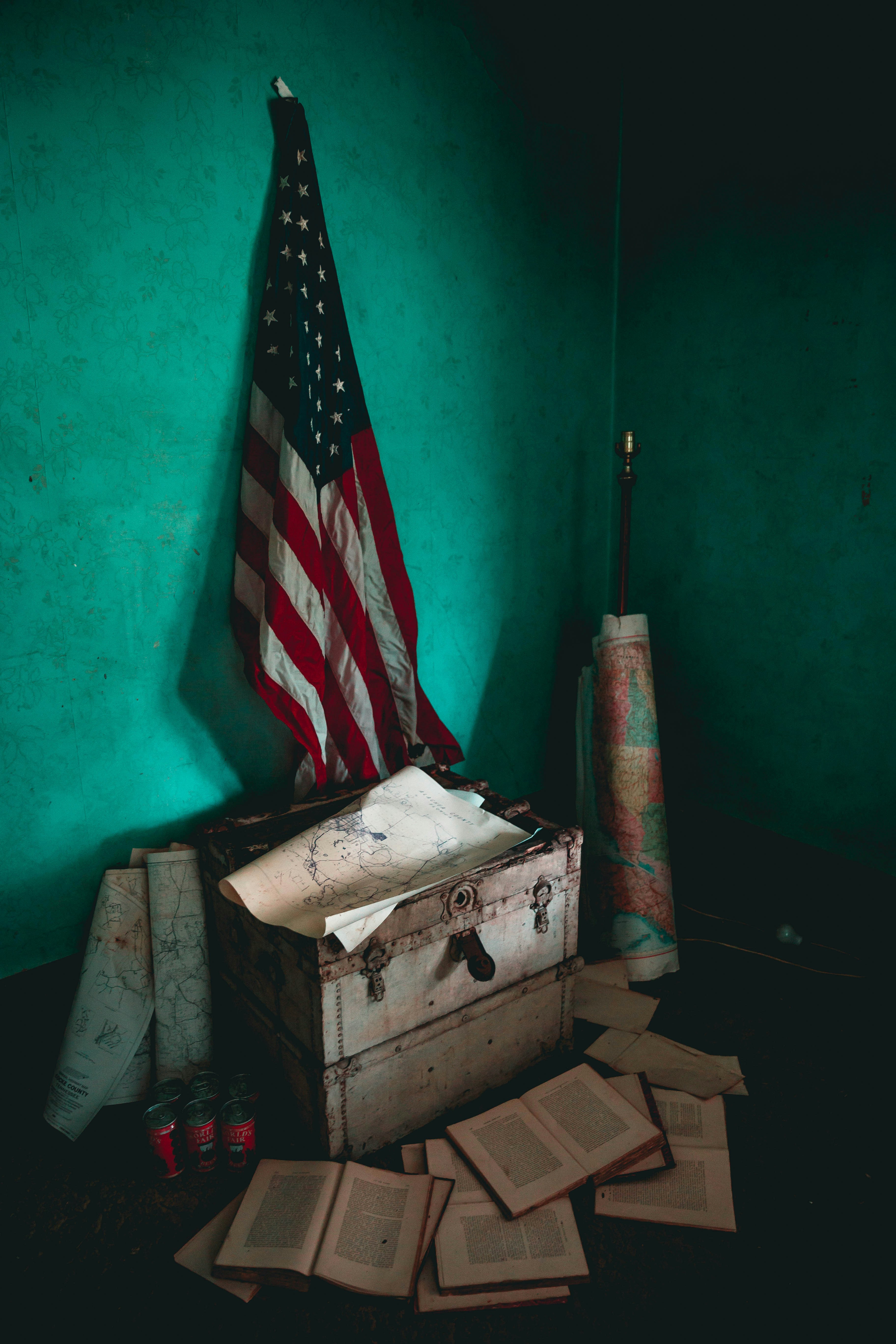 Flag and Maps: a Quiet Archive in Teal Light
