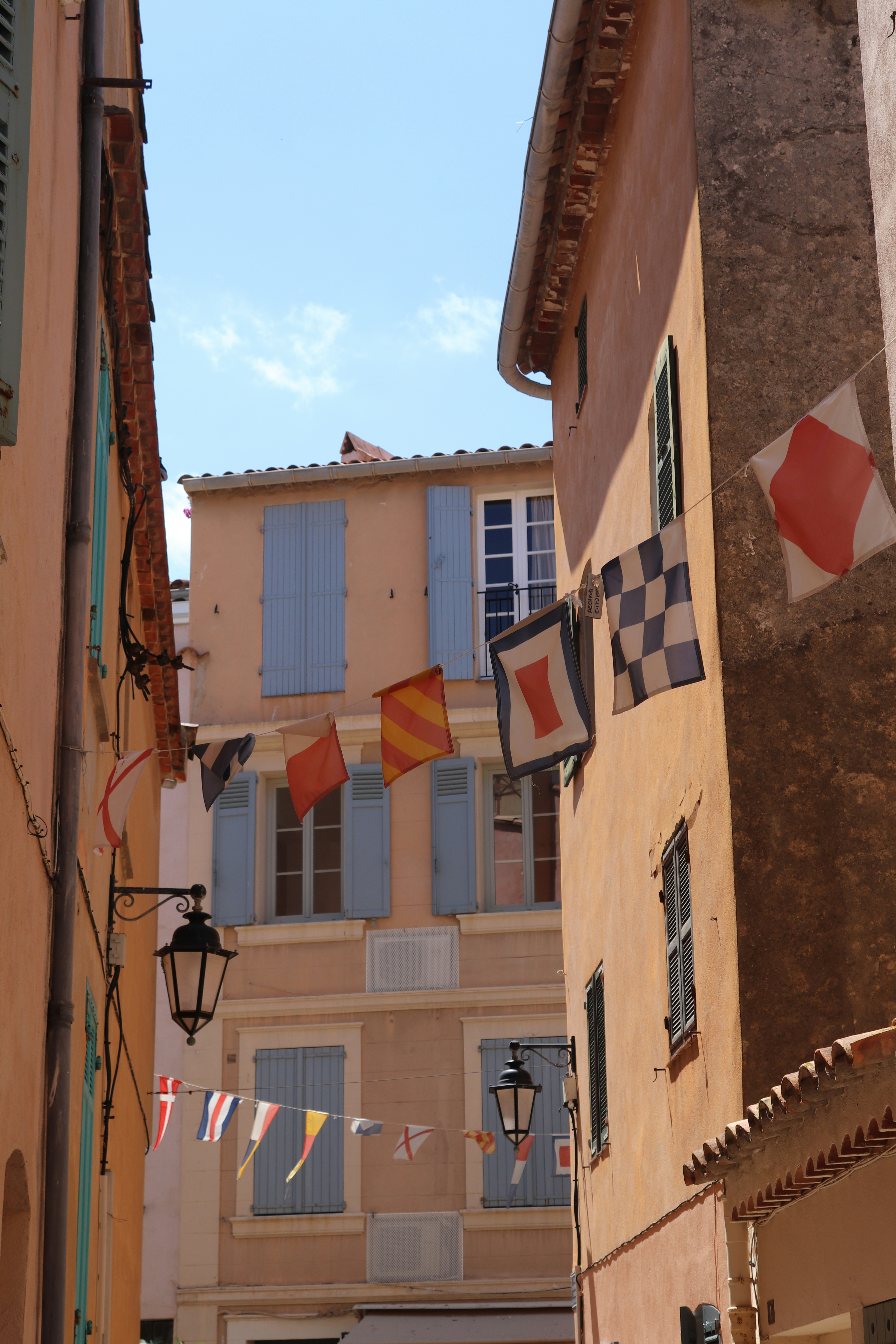 Nautical bunting strung between houses in St Tropez