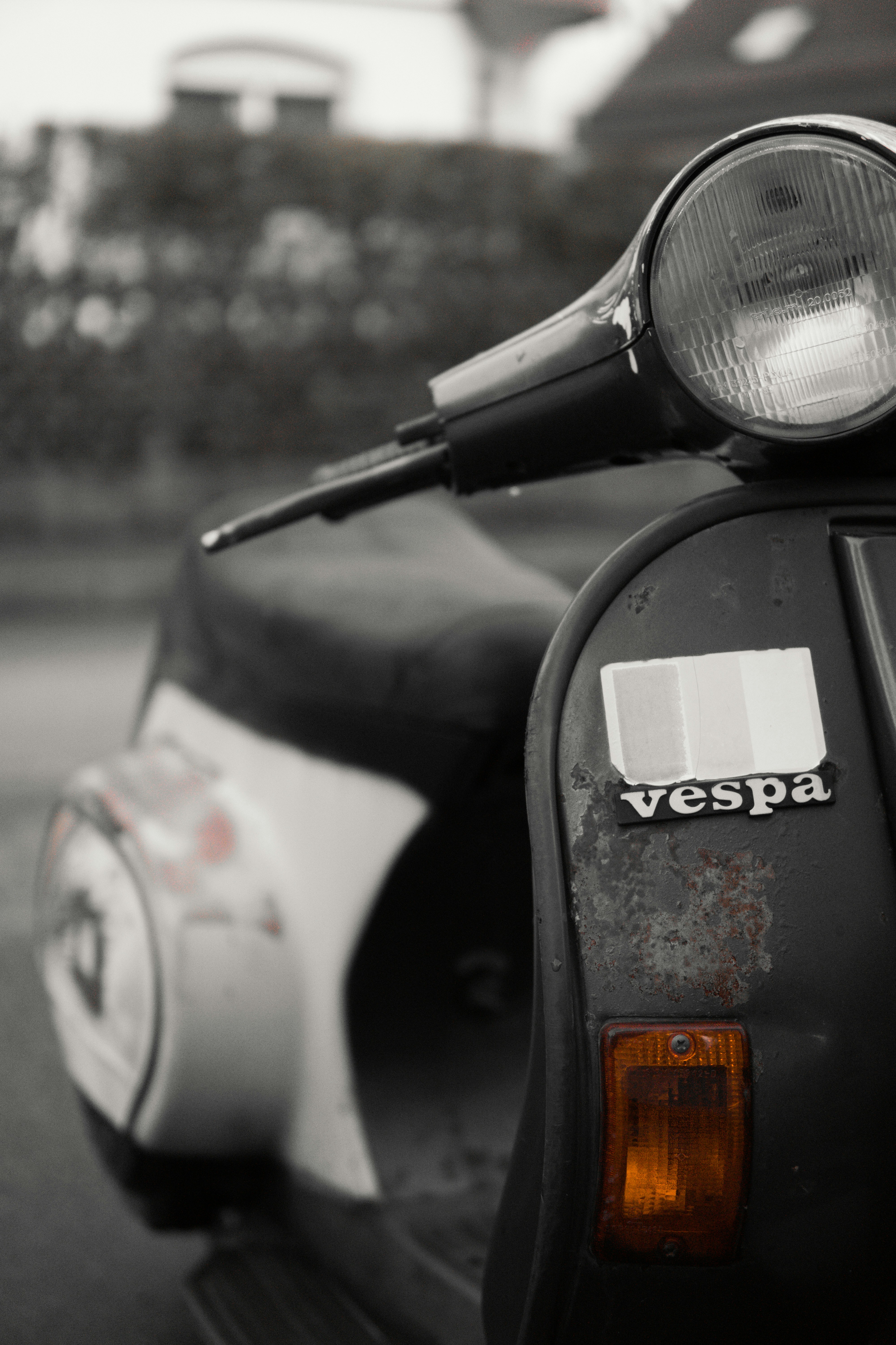 Rust and Chrome: A Close-Up on a Vespa Emblem