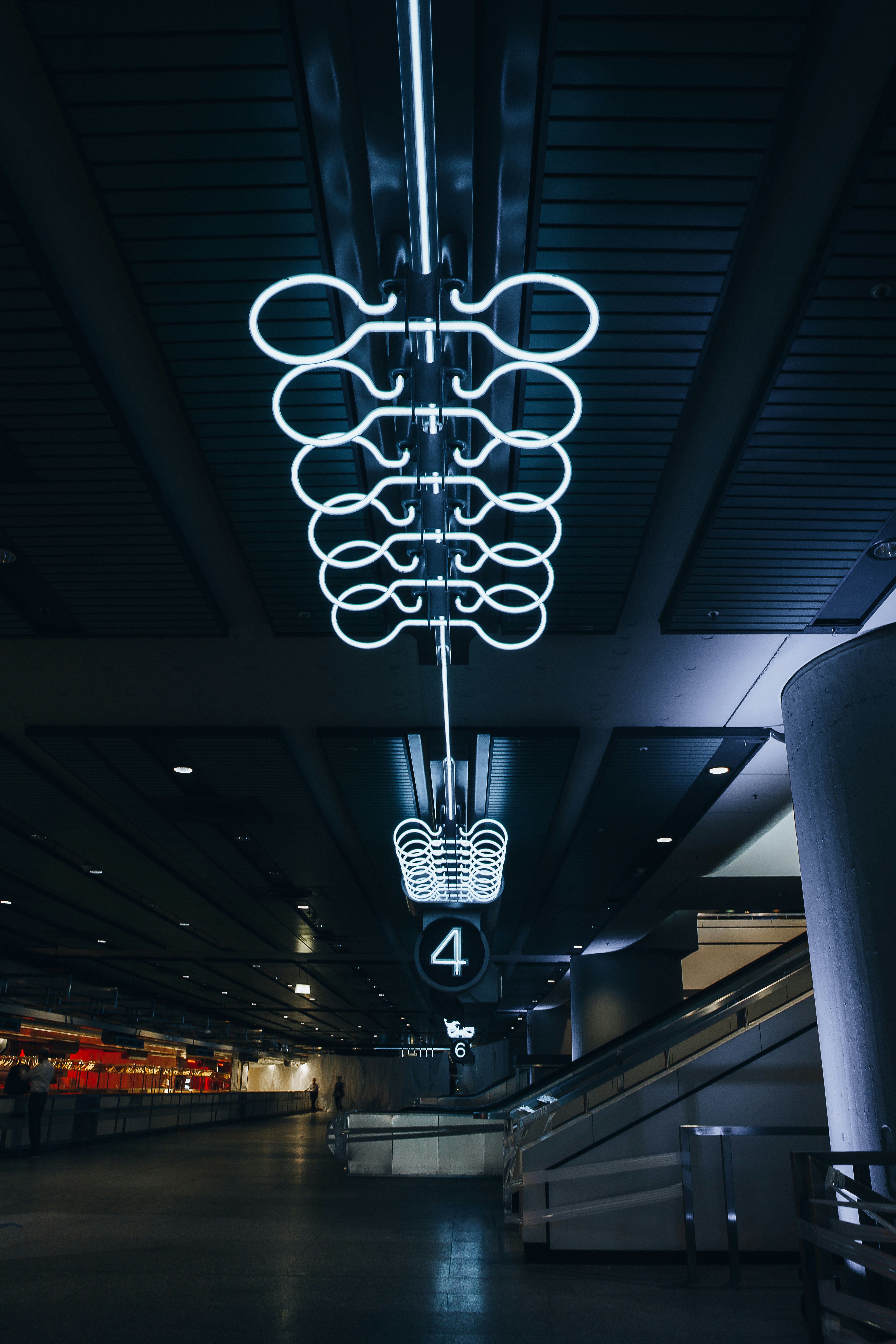 Neon Loop Cascade Above a Quiet Subway Platform