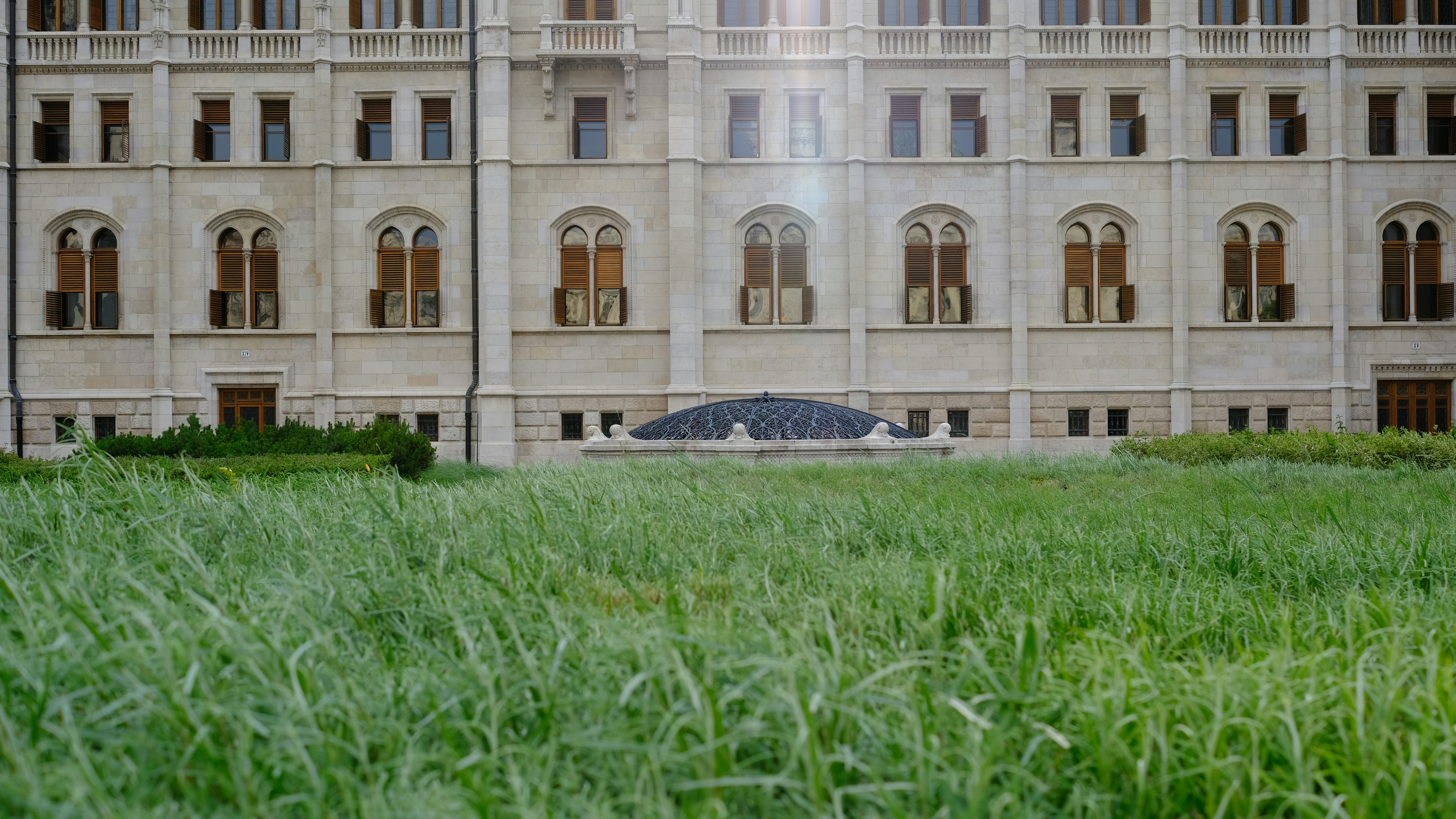 Verdant Foreground Meets a Historic Facade: The Central Dome