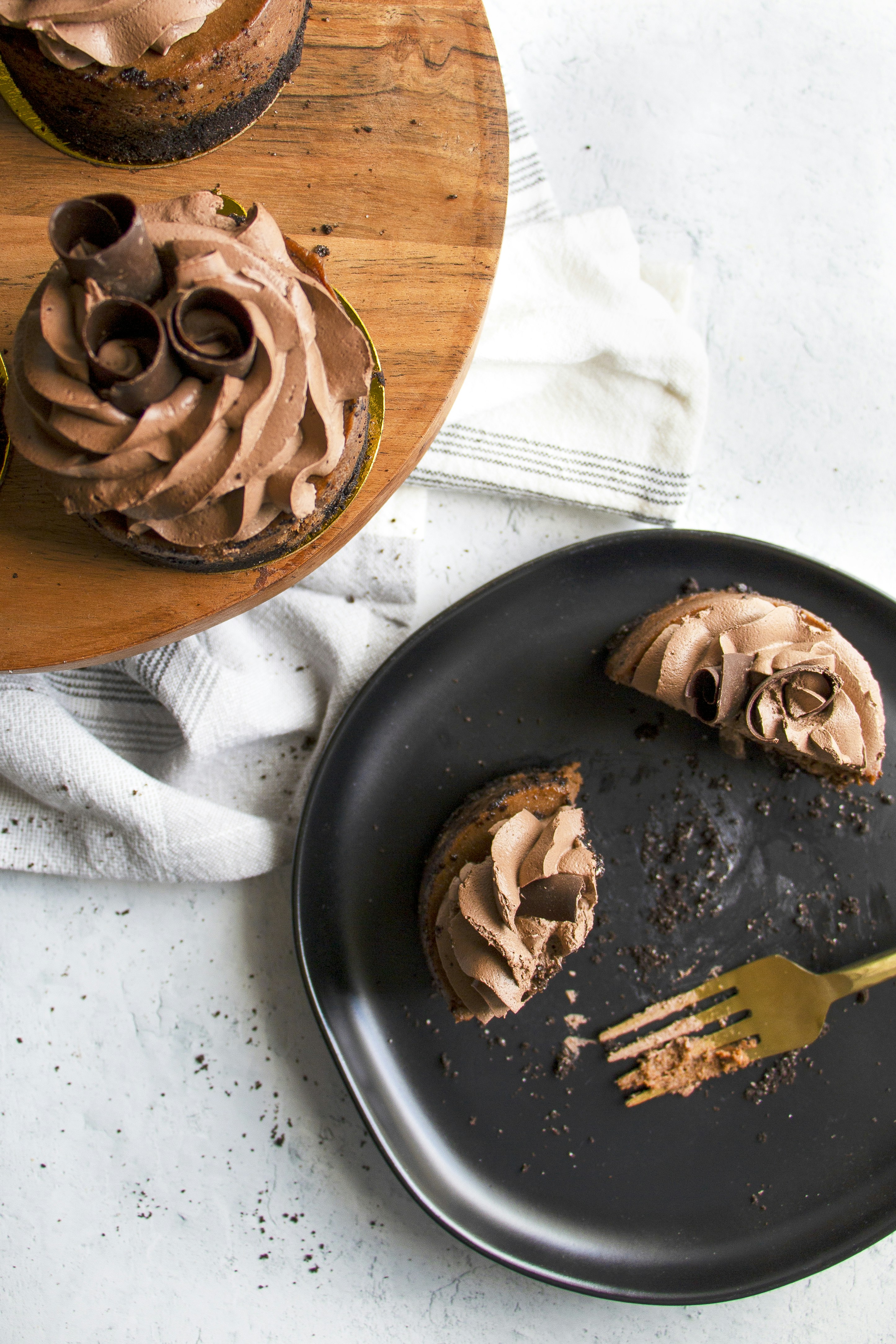 Cocoa Swirls Crown Chocolate Cupcakes on a Rustic Wooden Board