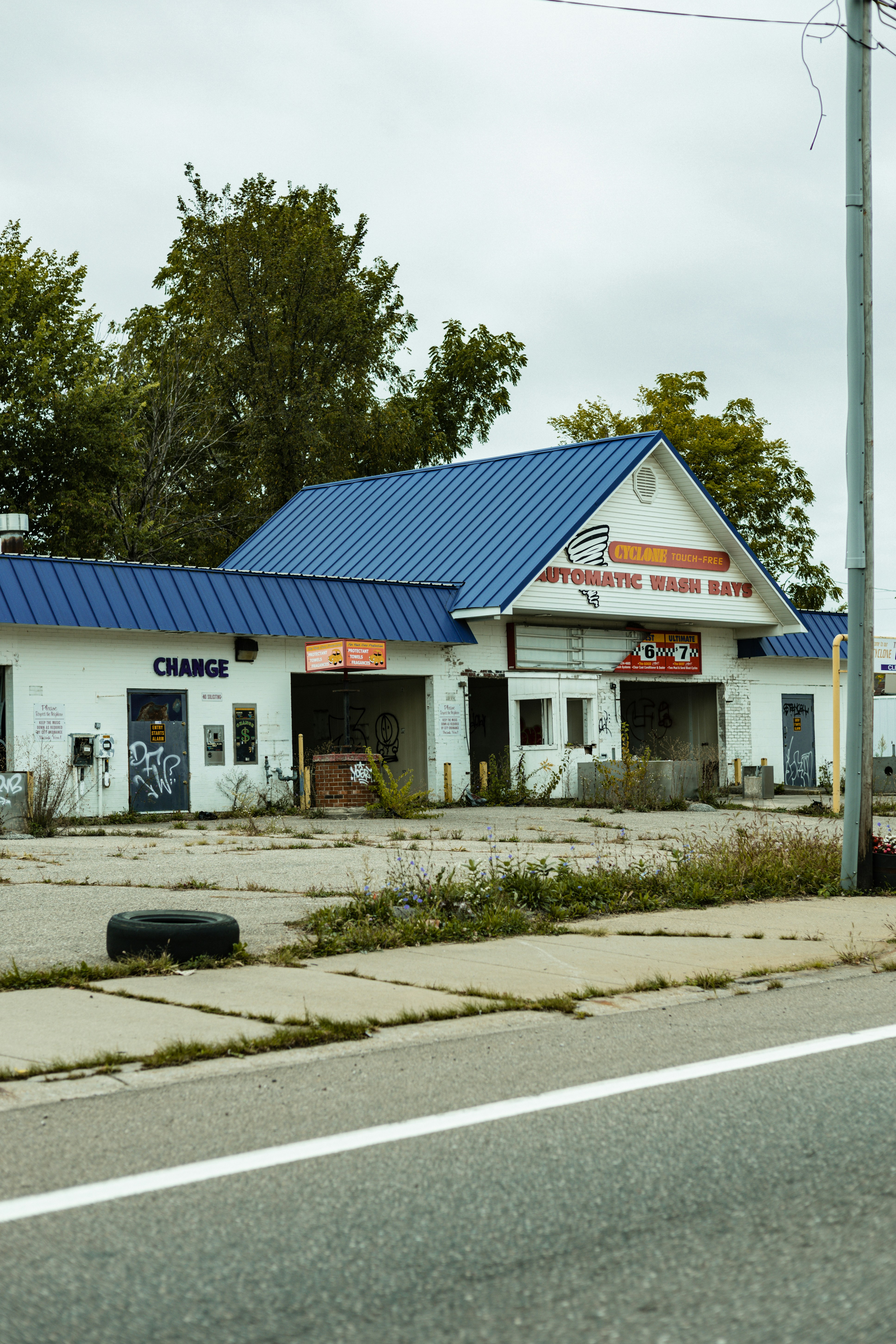 Blue-Roofed Relic: a Forgotten Auto Wash on an Empty Street