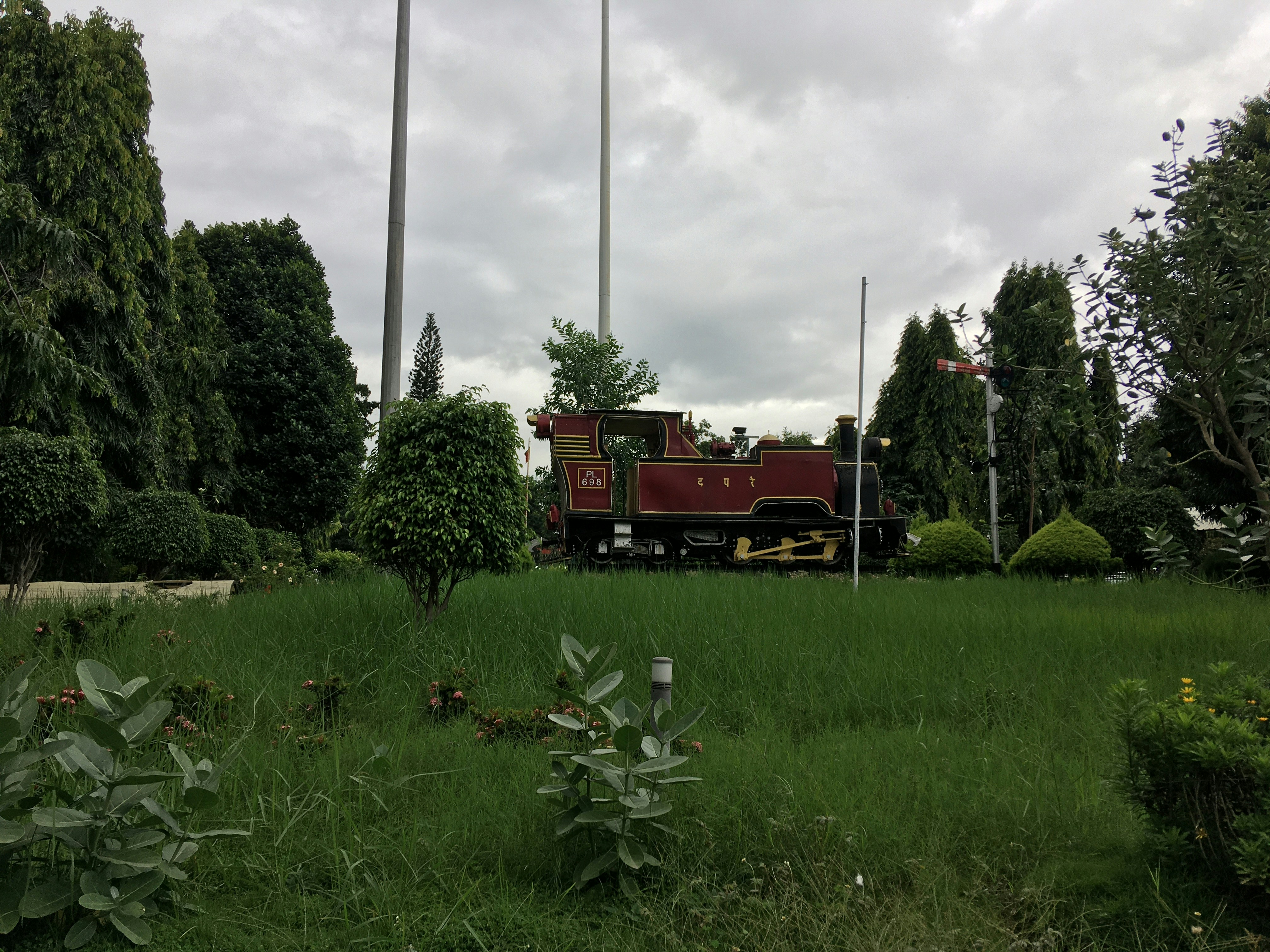 Tiny Steam Power: A Brass Locomotive Guarded by Garden Rings