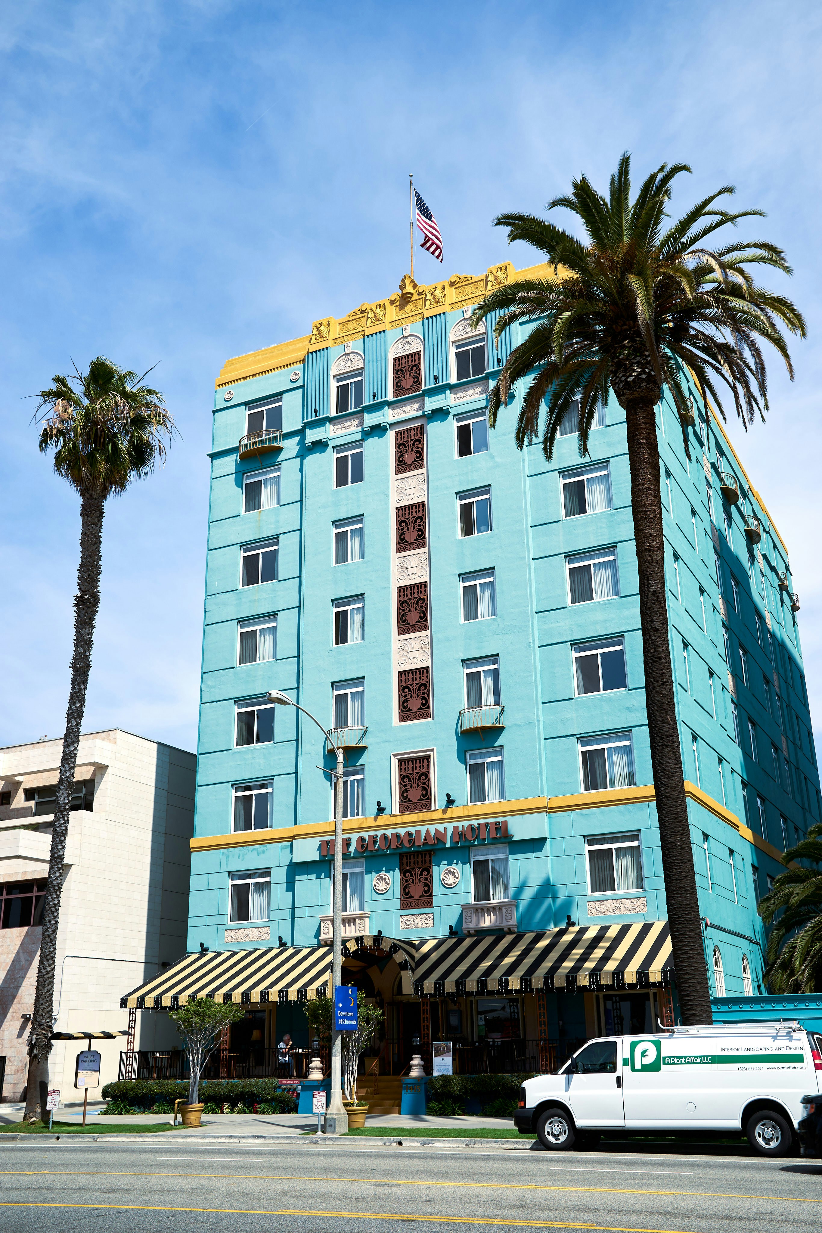 A blue building with a flag on top photo – Free Santa monica beach ...
