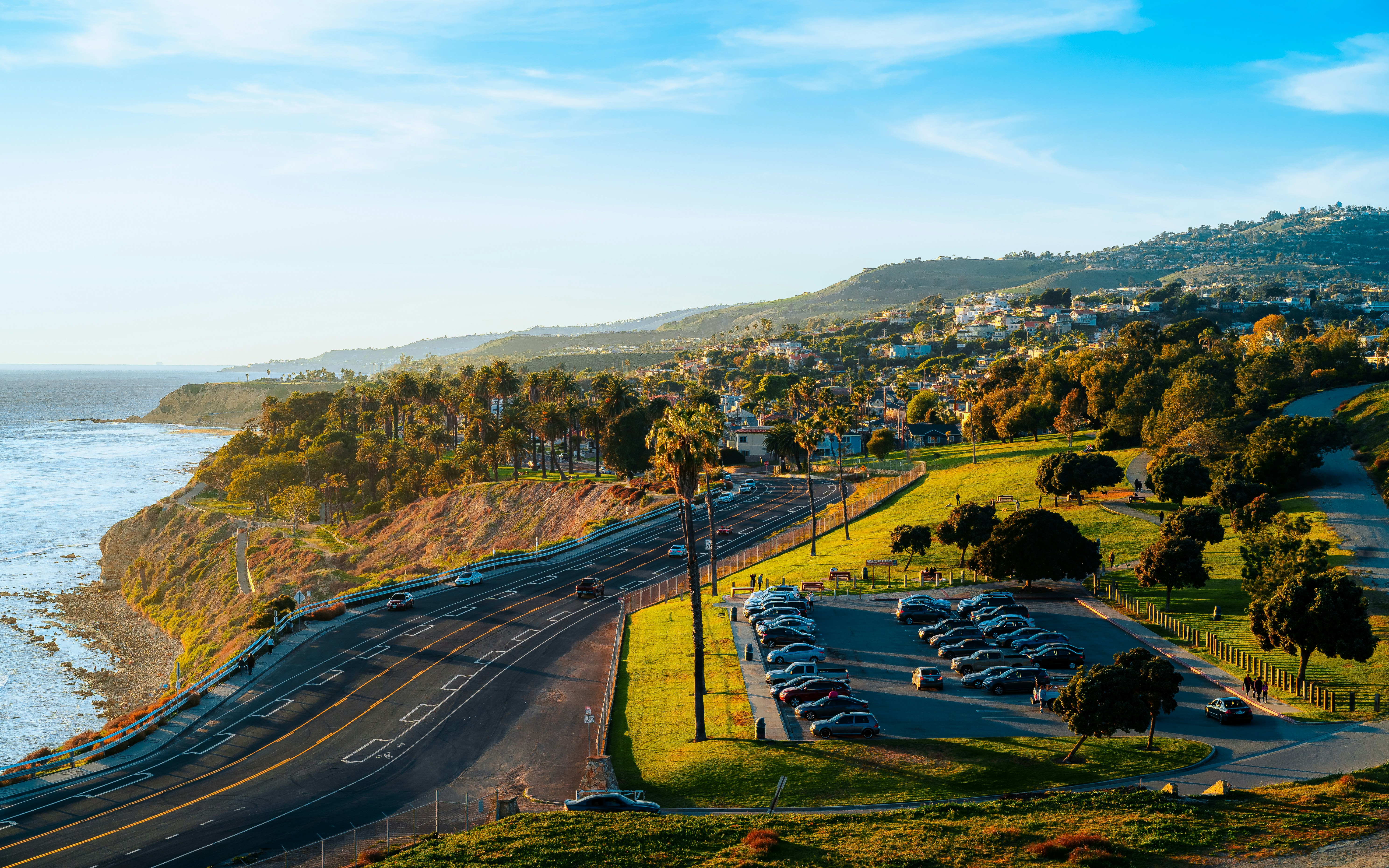 a parking lot next to a beach