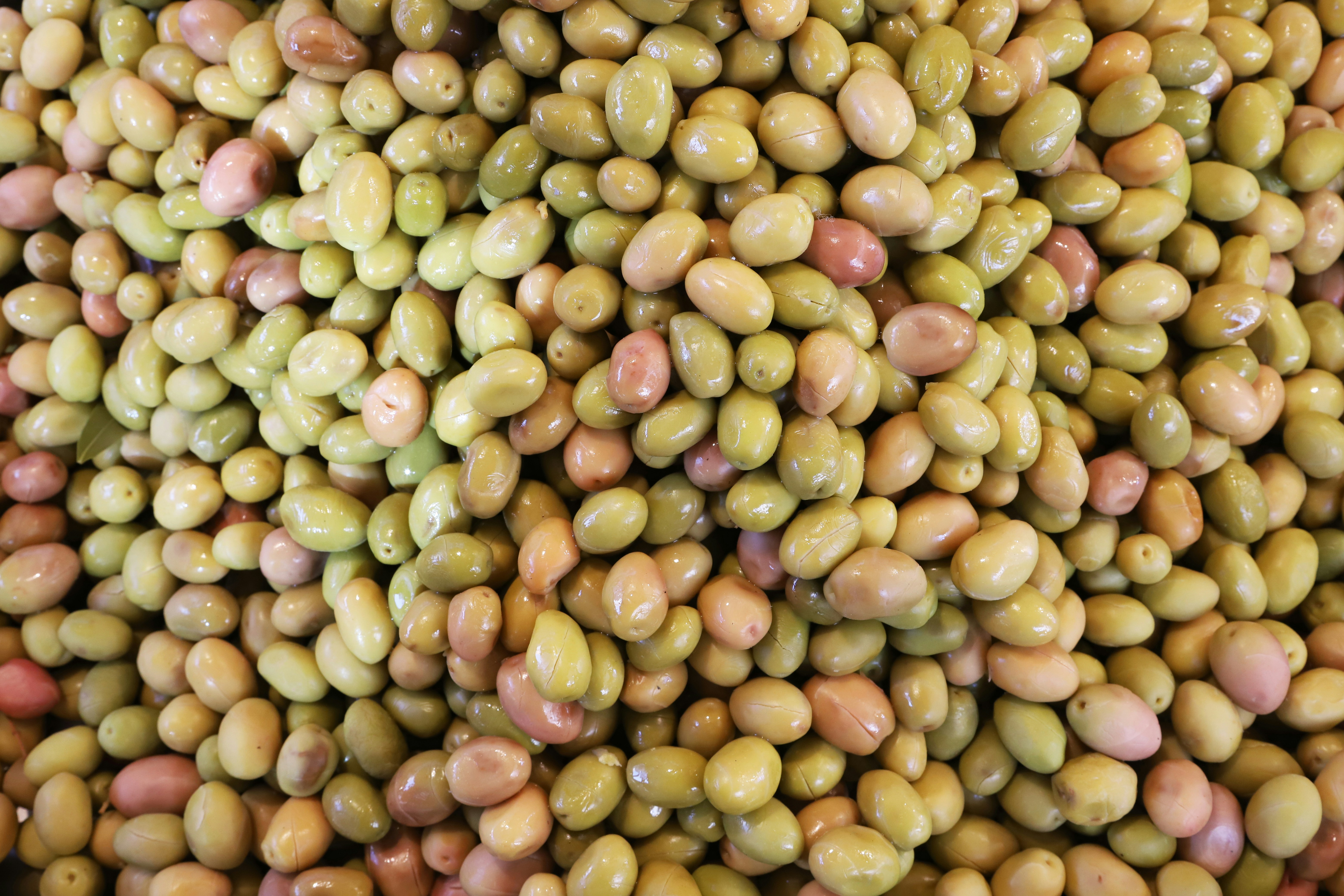 A pile of colorful round objects photo – Free Olives Image on Unsplash