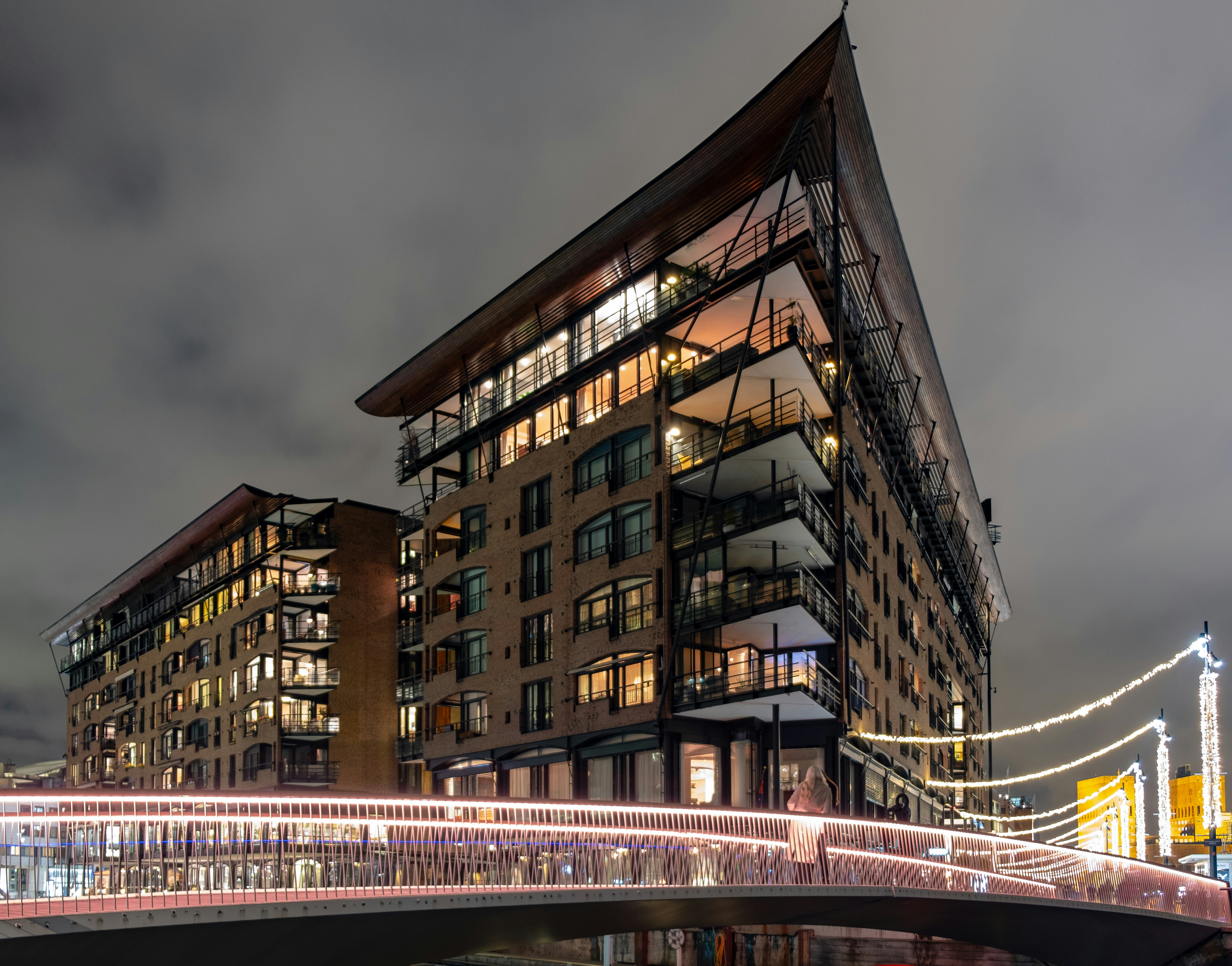 A building with a bridge in front of it photo – Free Aker brygge Image ...