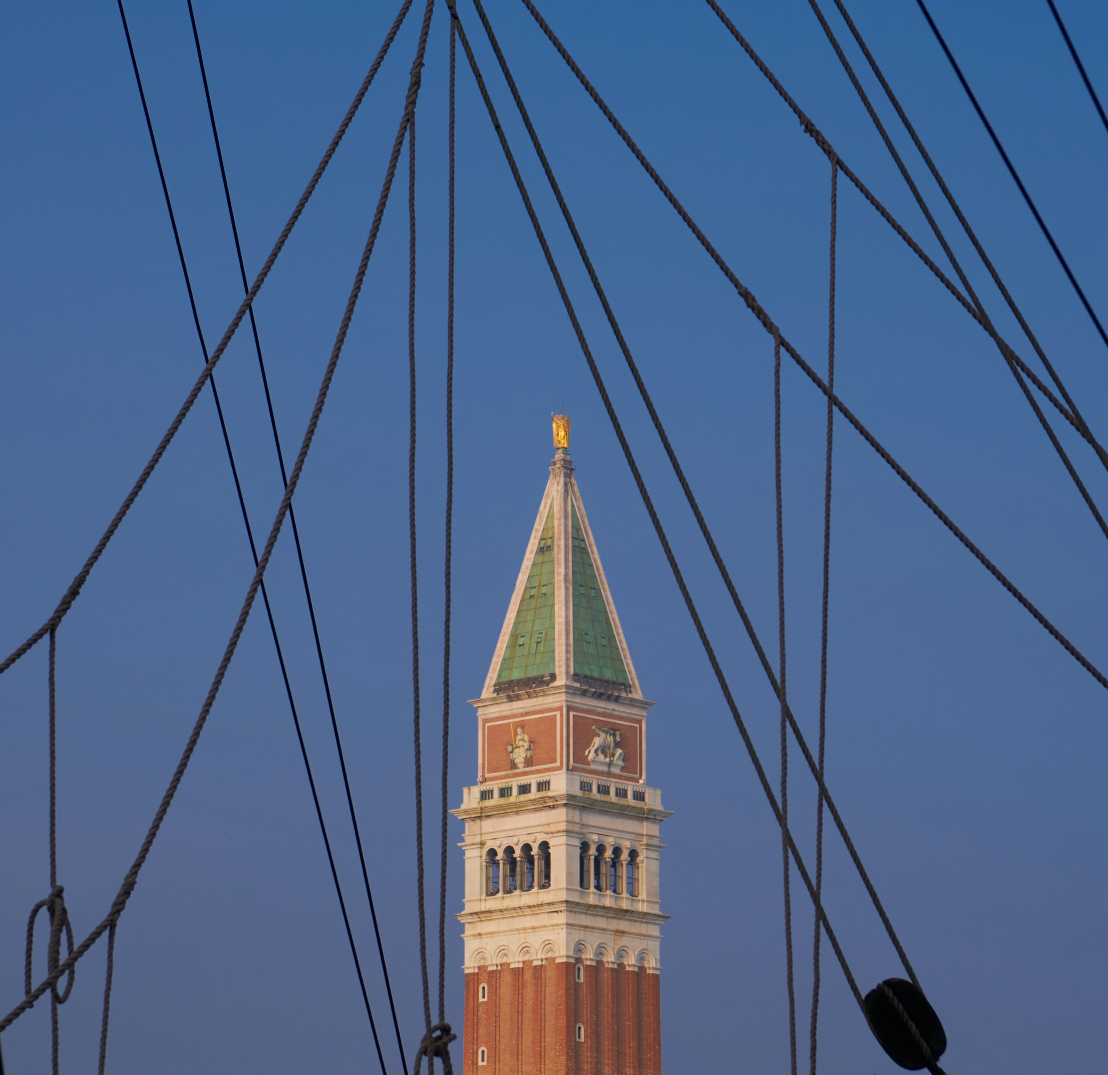 a clock tower with cables