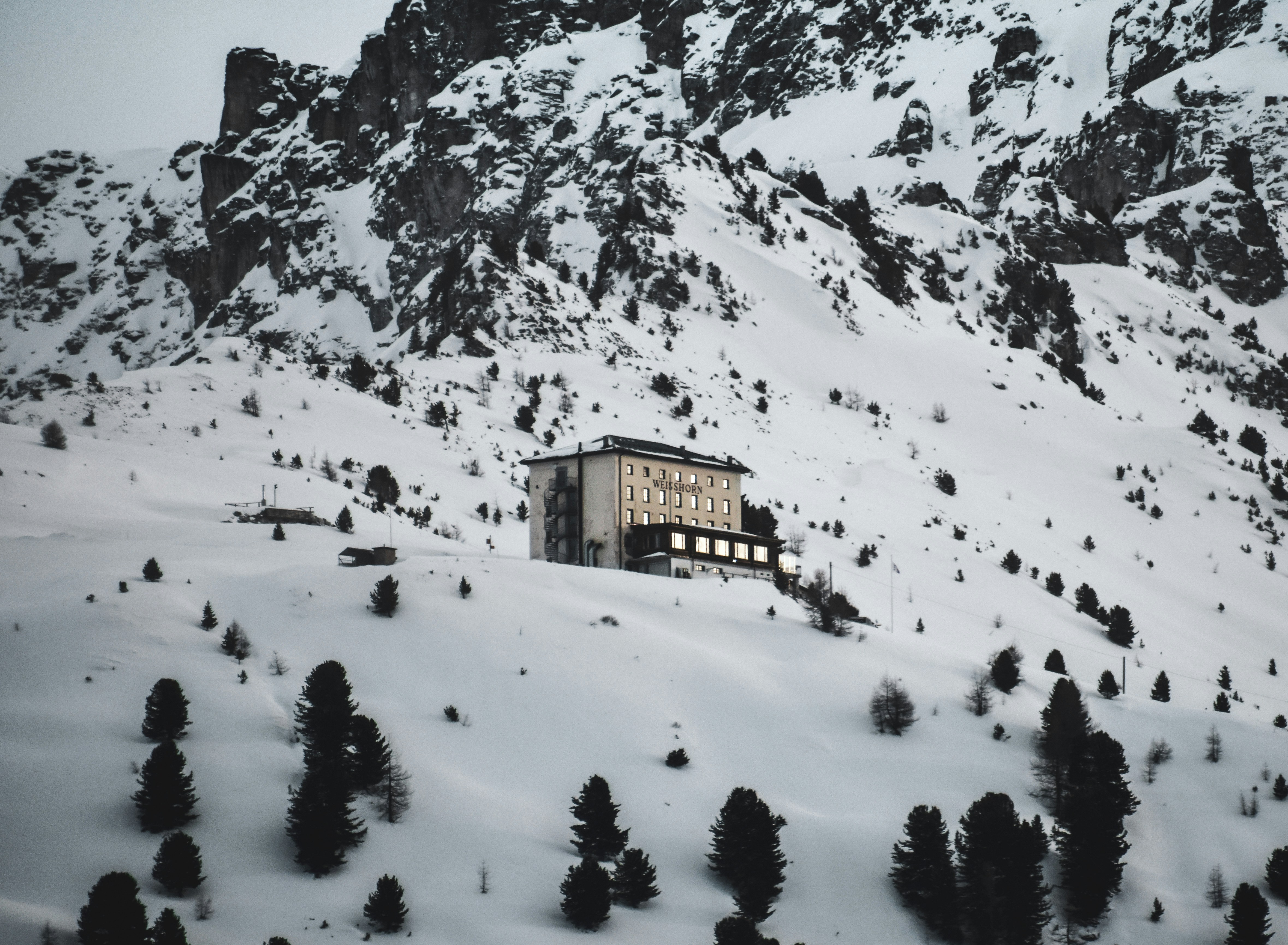 A building on a snowy mountain photo – Free Grey Image on Unsplash