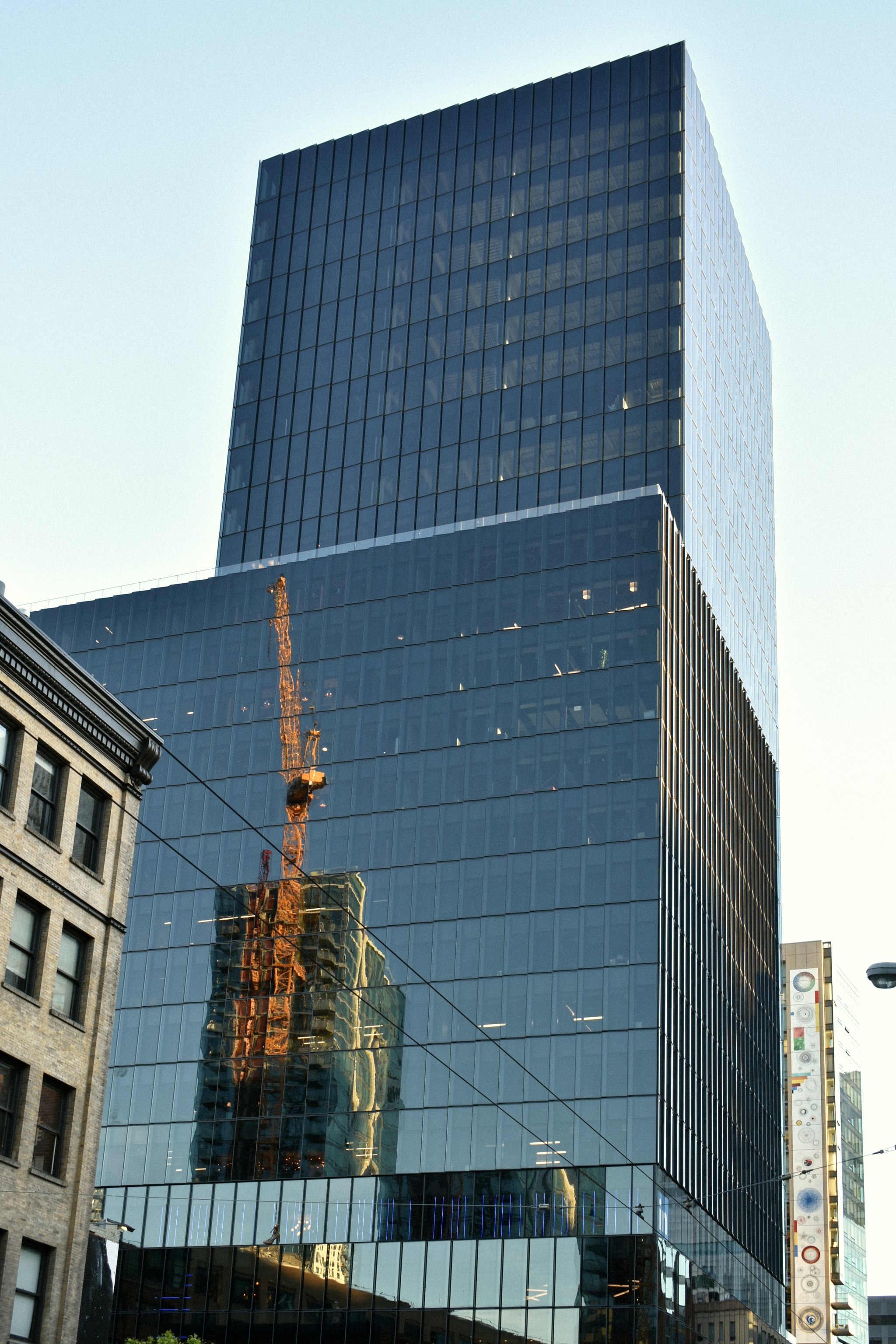 Crane's Echo in a Glass-Walled Skyline