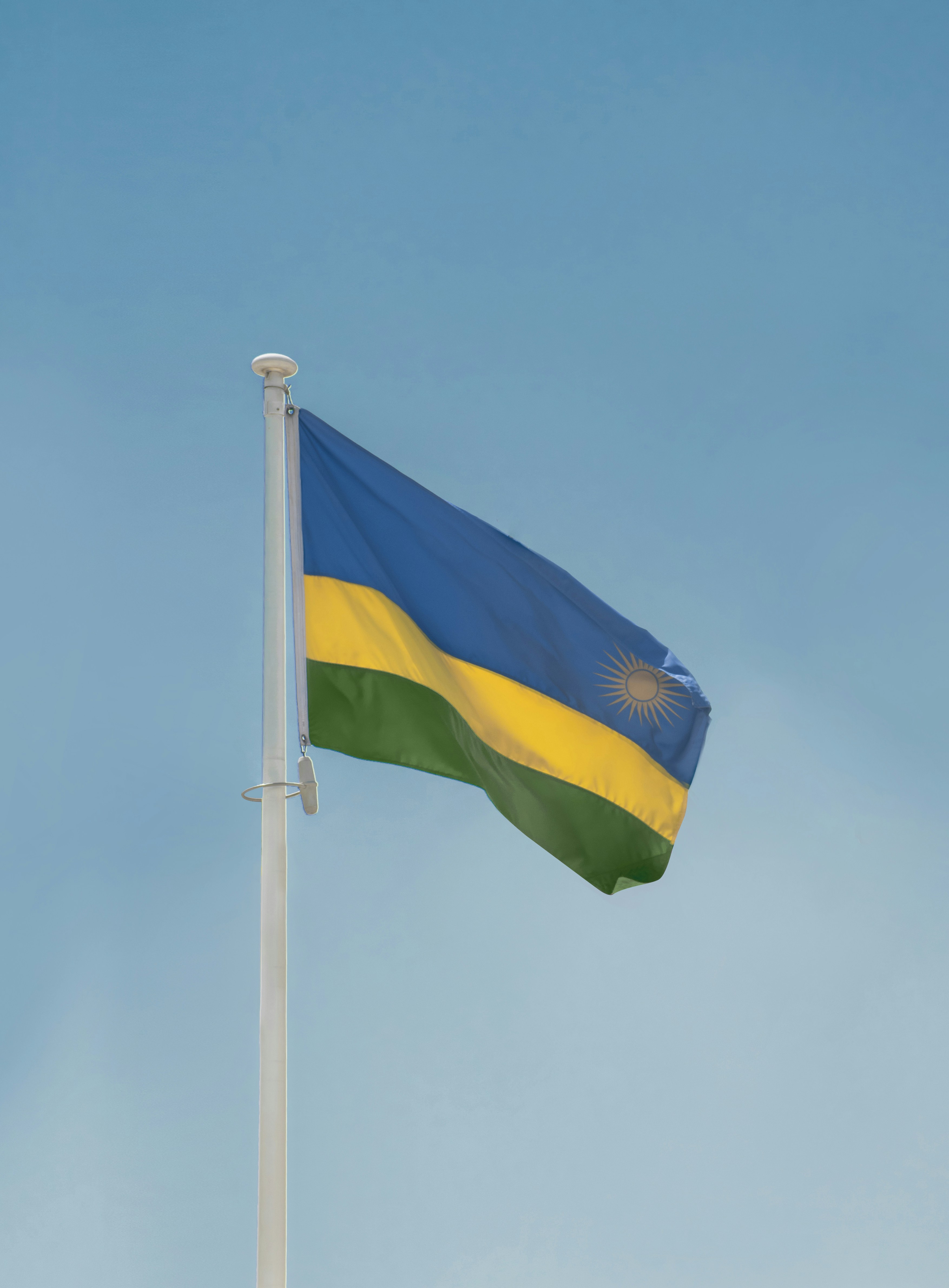 A flag on a pole photo – Free Blue Image on Unsplash