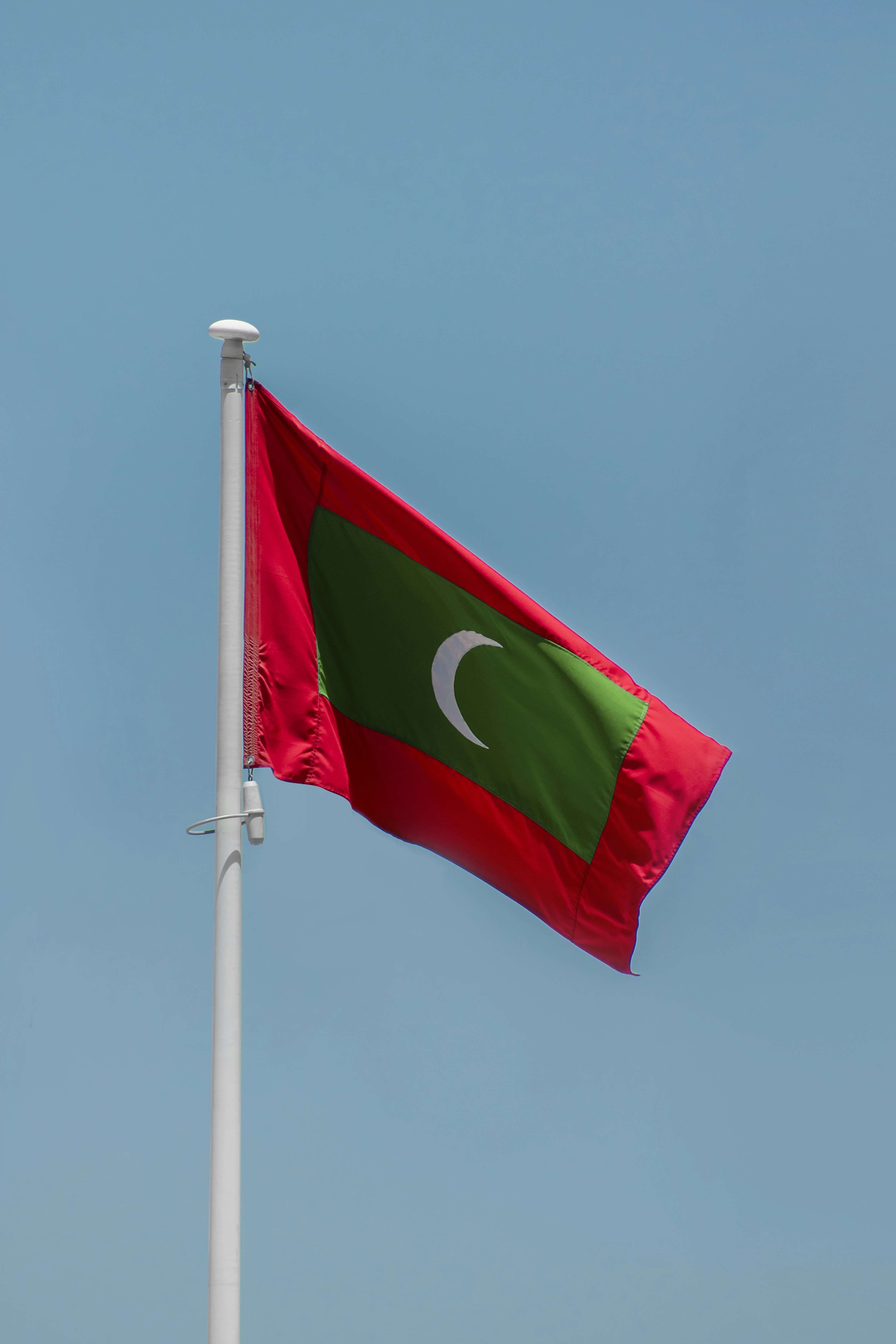 Un drapeau rouge et vert photo – Photo Maldives Gratuite sur Unsplash