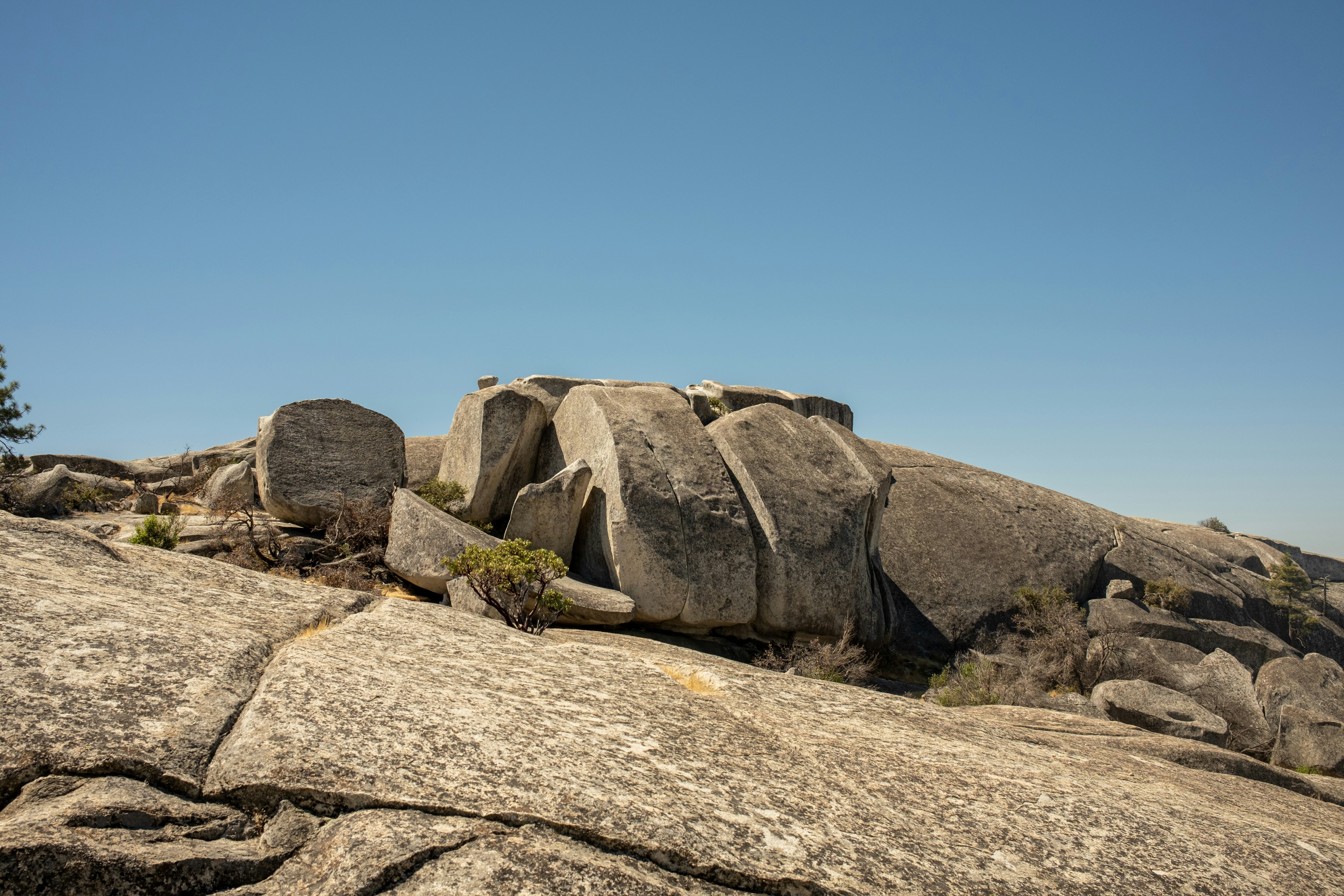A rocky area with a blue sky photo – Free Bald rock Image on Unsplash
