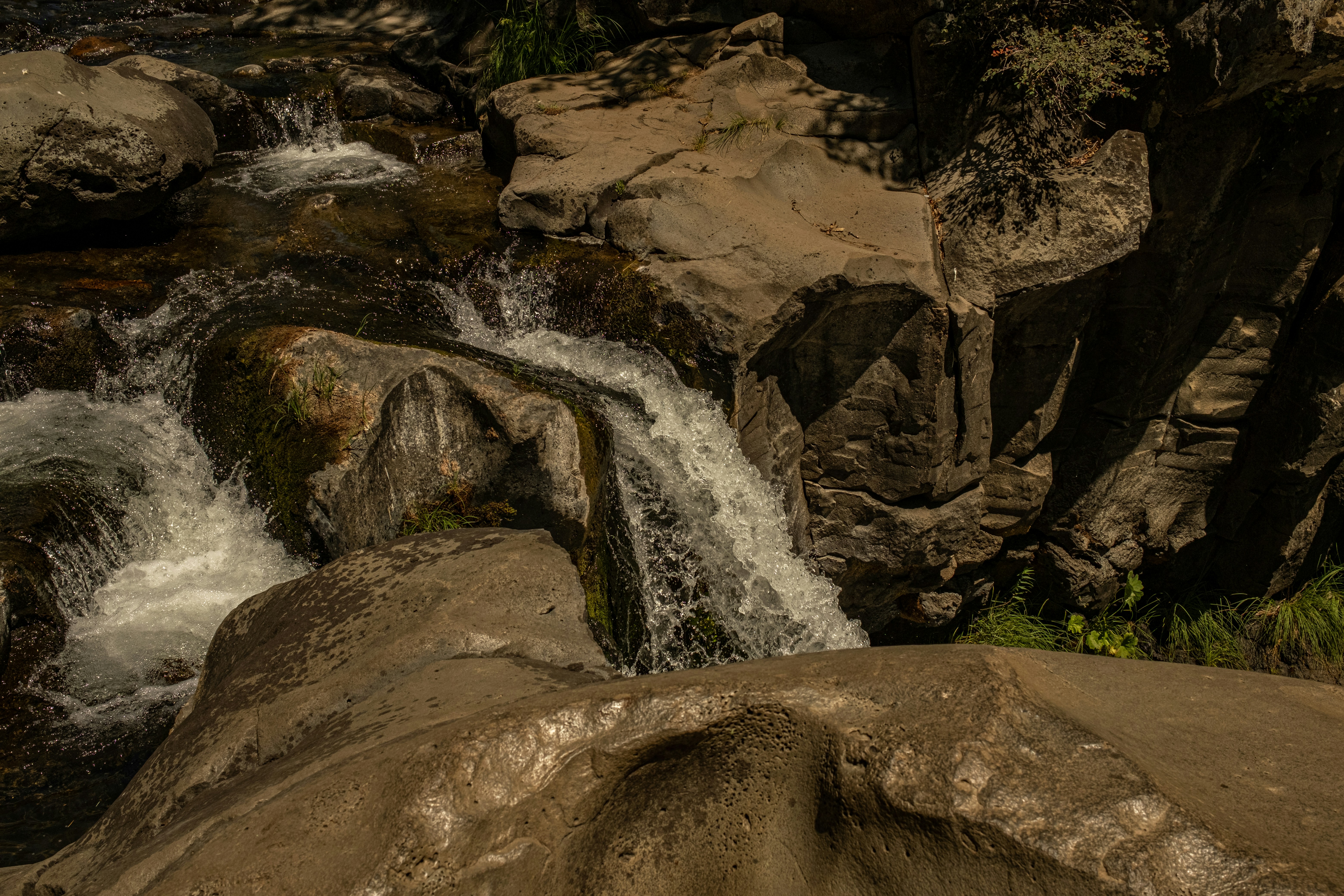 A waterfall over rocks photo – Free Nature Image on Unsplash