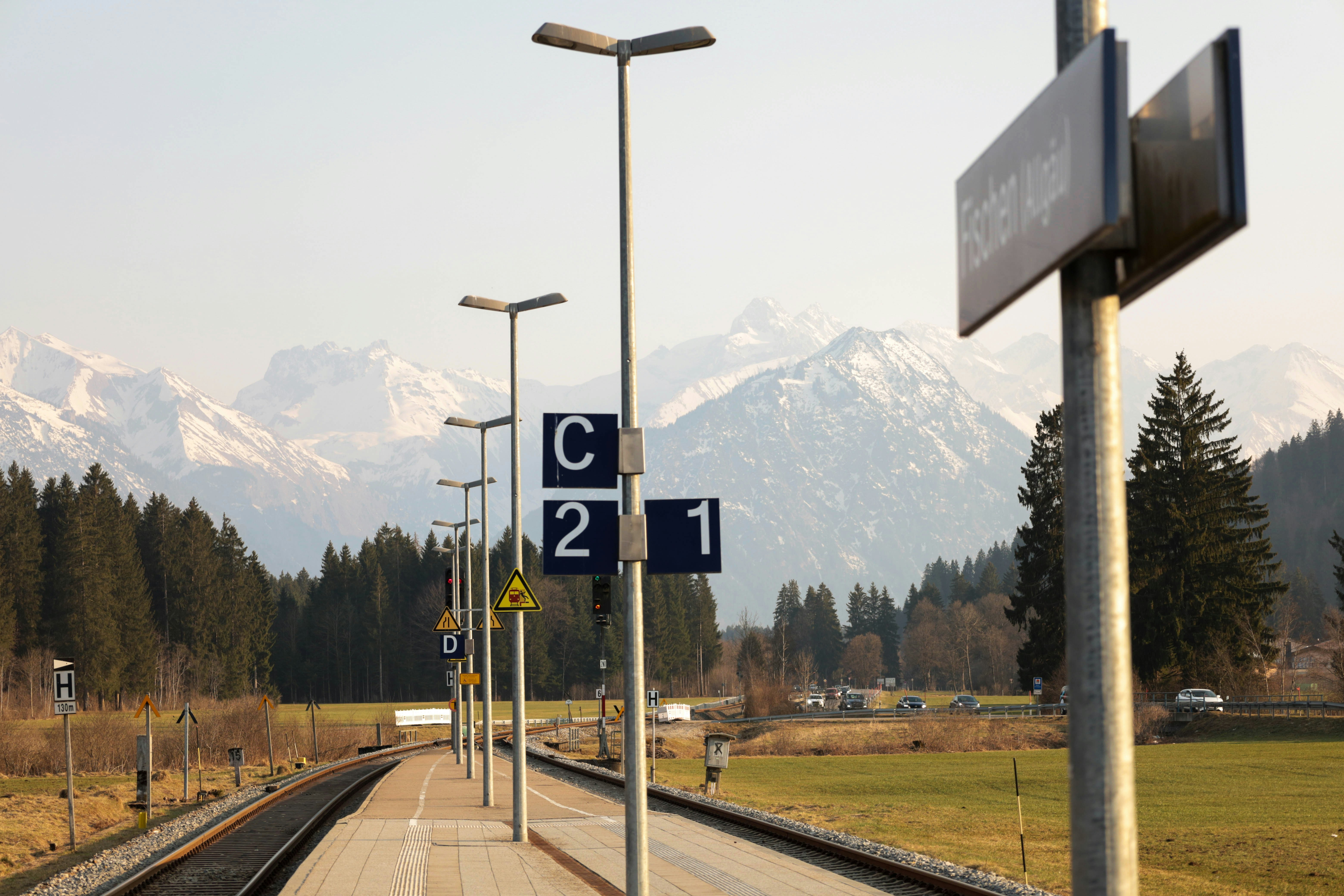A train track with signs on it photo – Free Rail Image on Unsplash