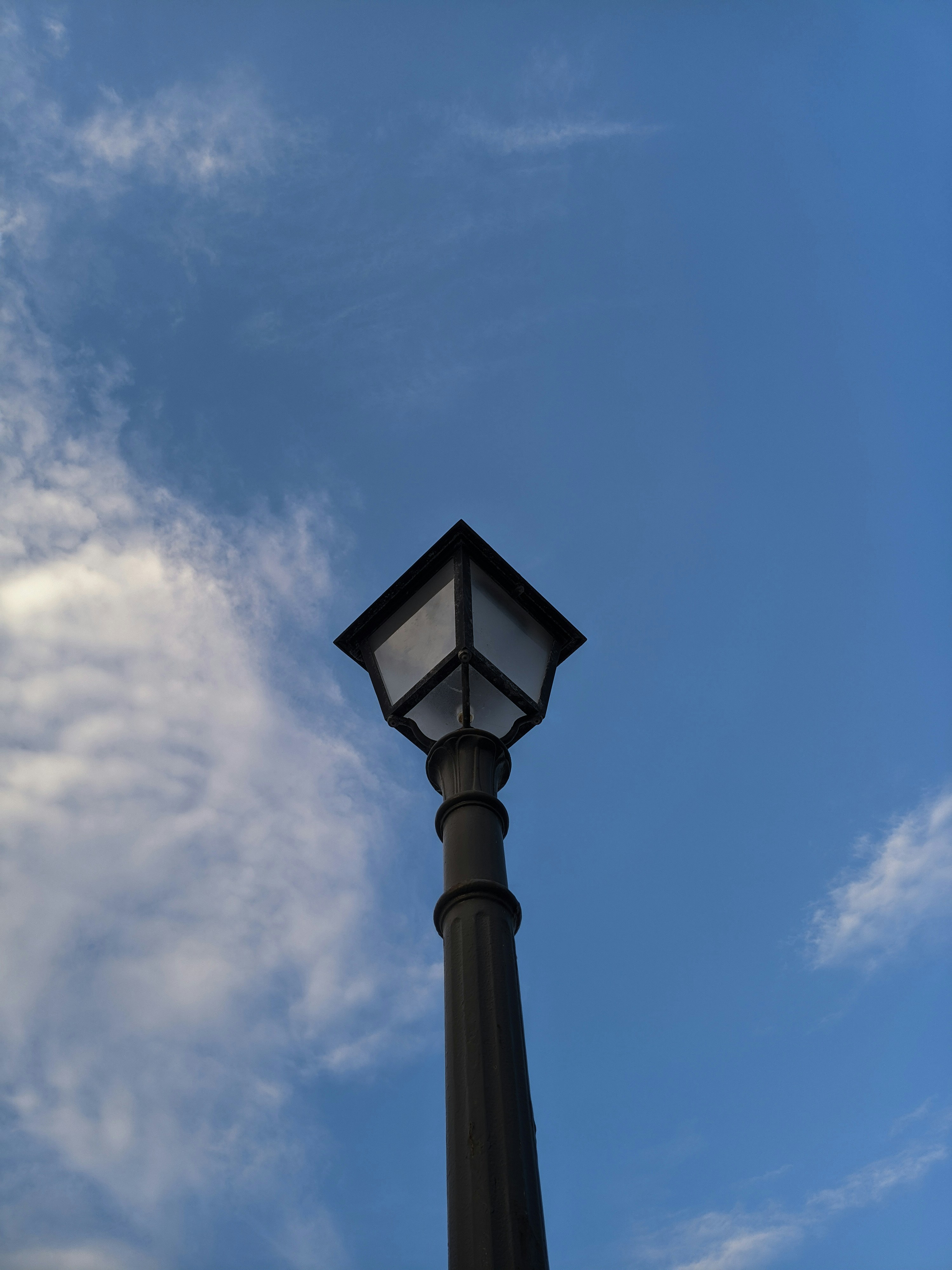 A lamp post with a blue sky photo – Free Beautiful Image on Unsplash