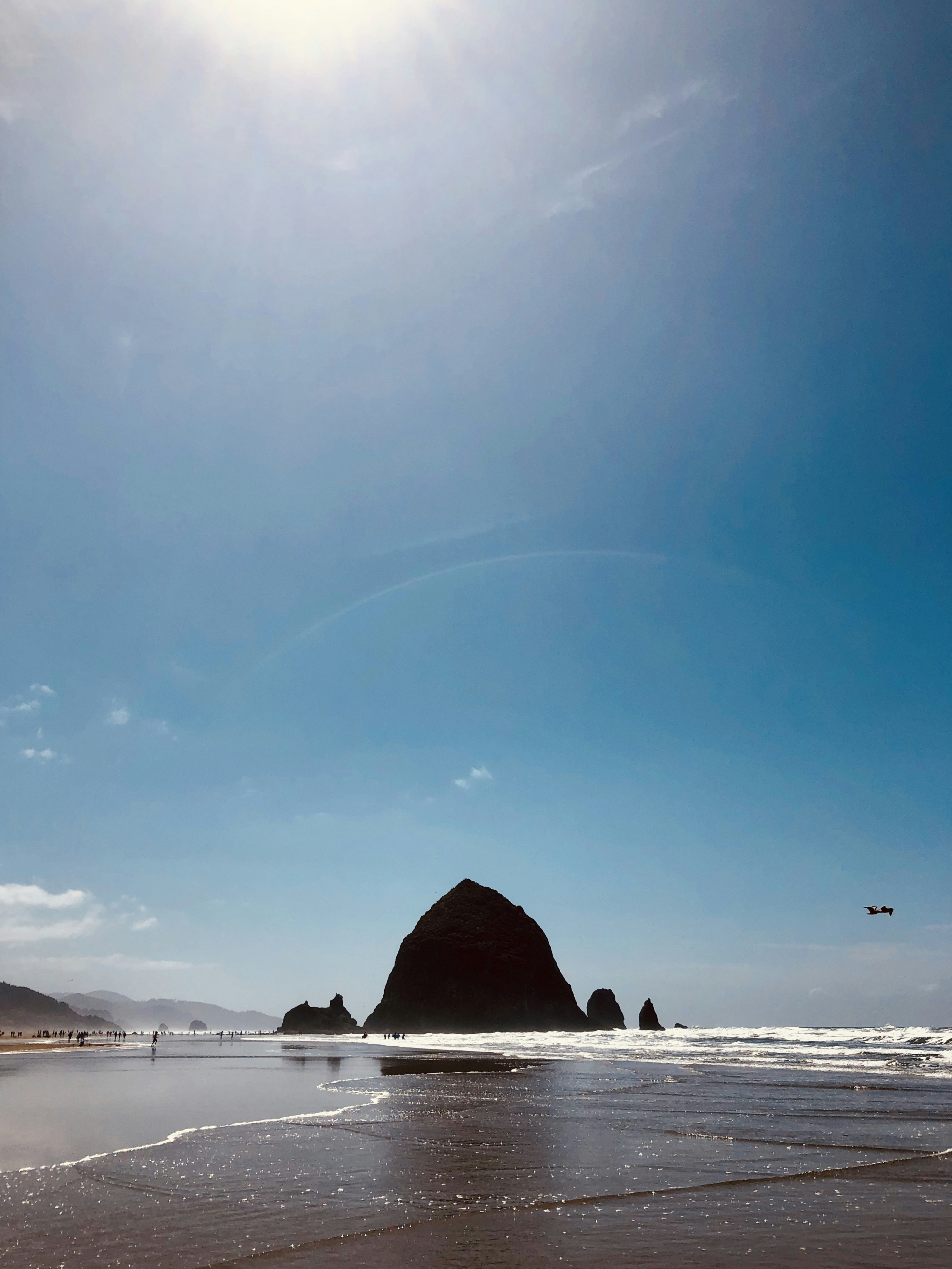 A beach with a rock formation in the distance photo – Free Cannon beach ...