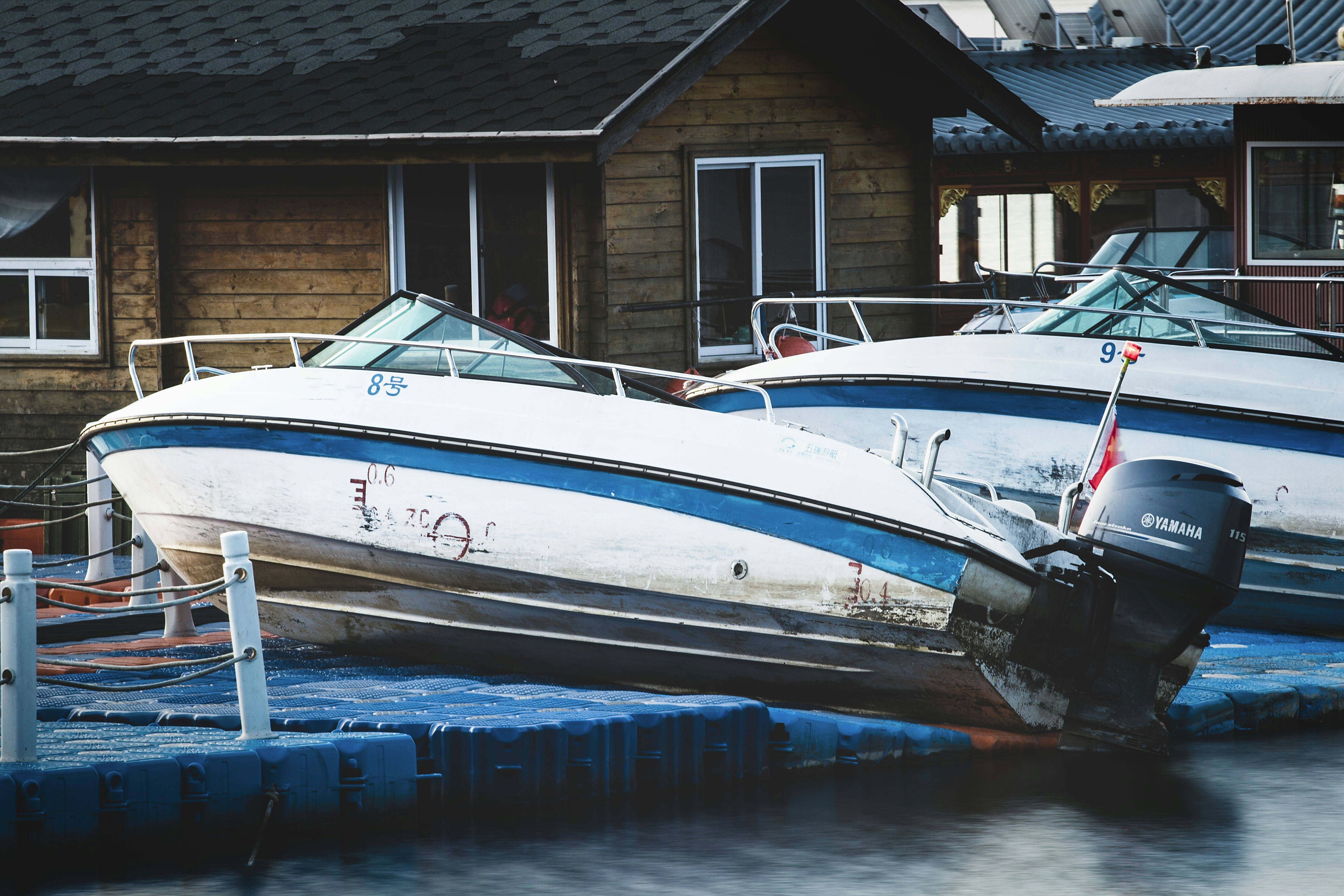 Dockside Blues: Quiet Pause Among White-and-Blue Powerboats