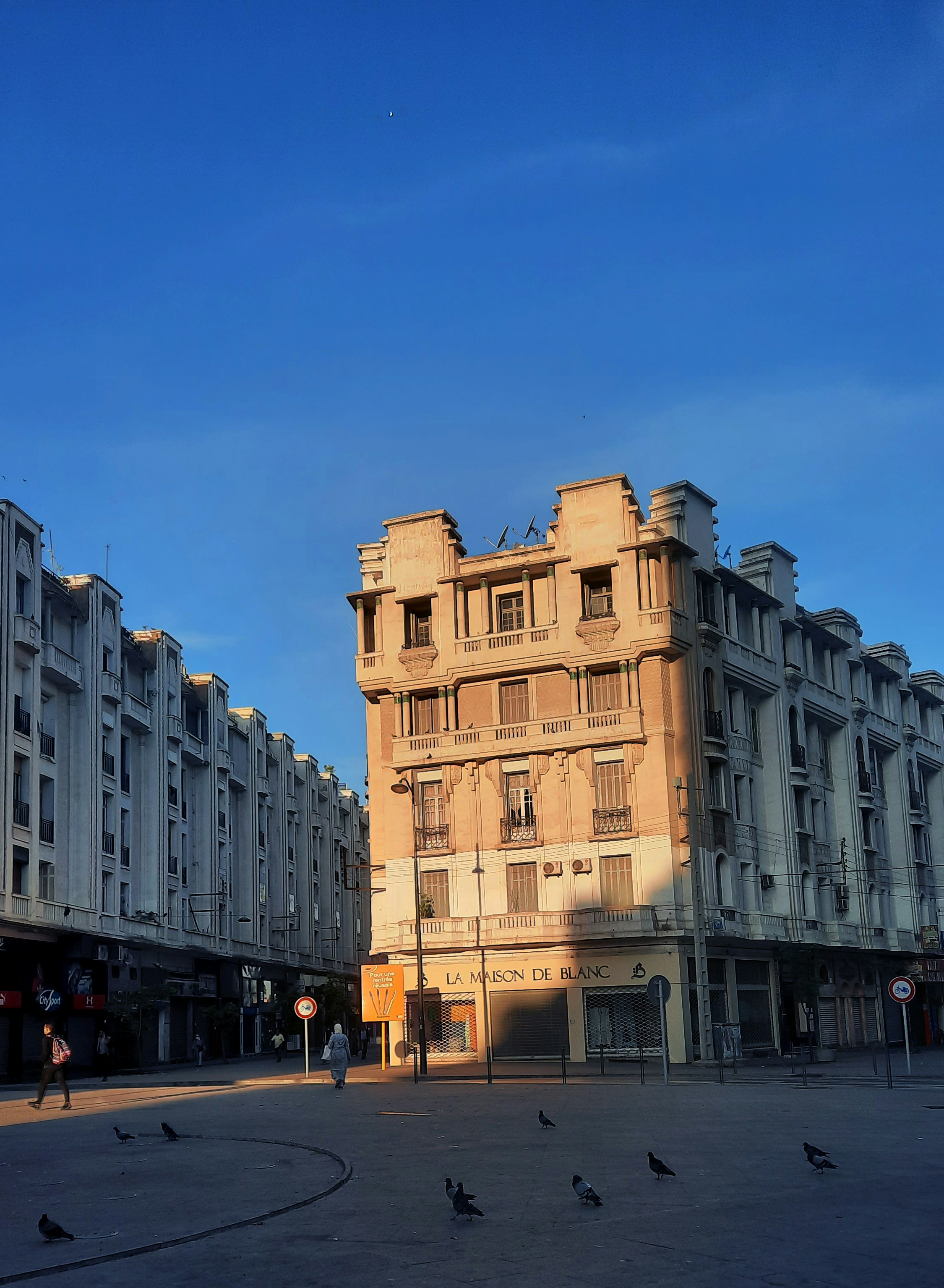 Sunlit Central Facade Framed by Row Houses