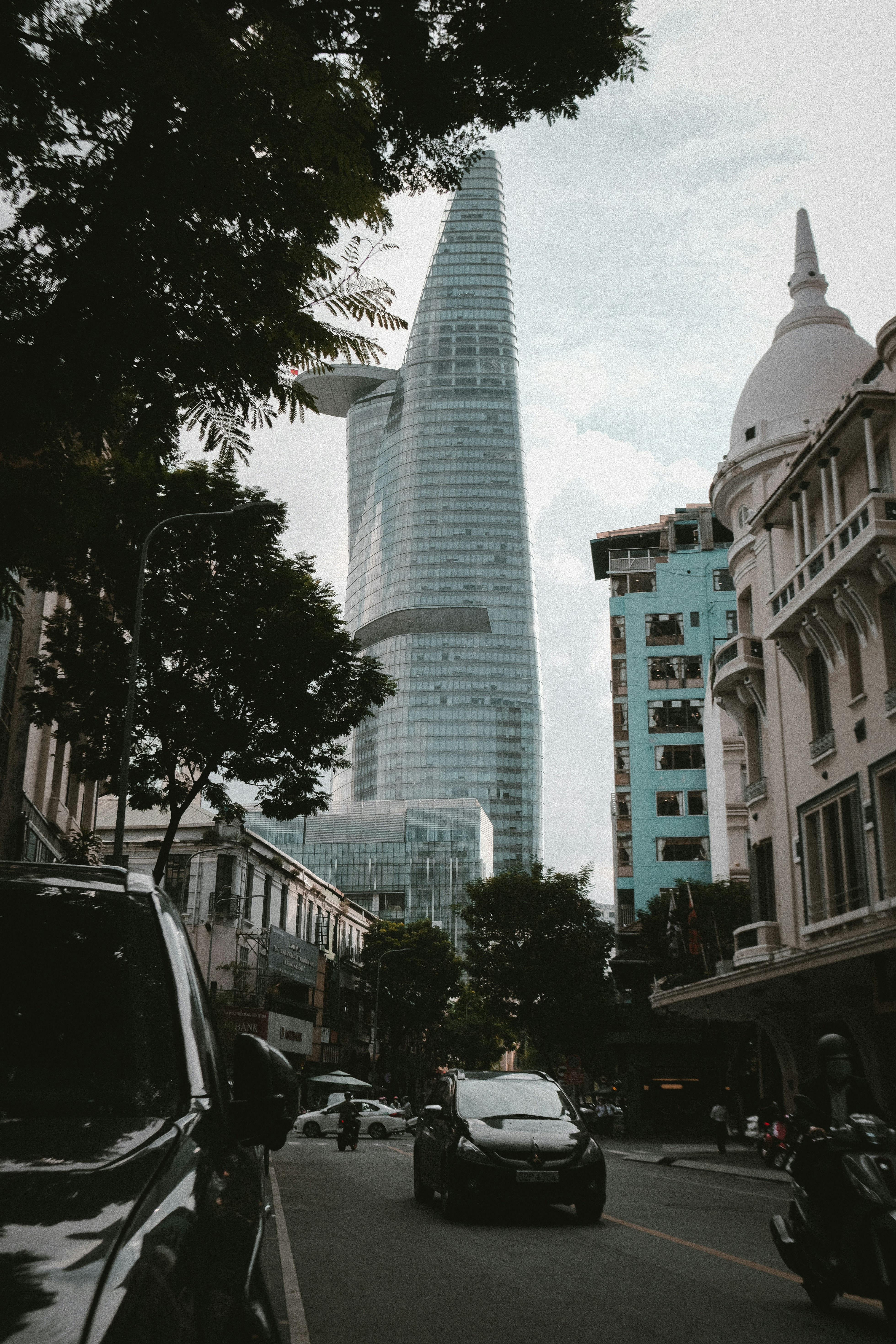 a street with cars and buildings on either side of it