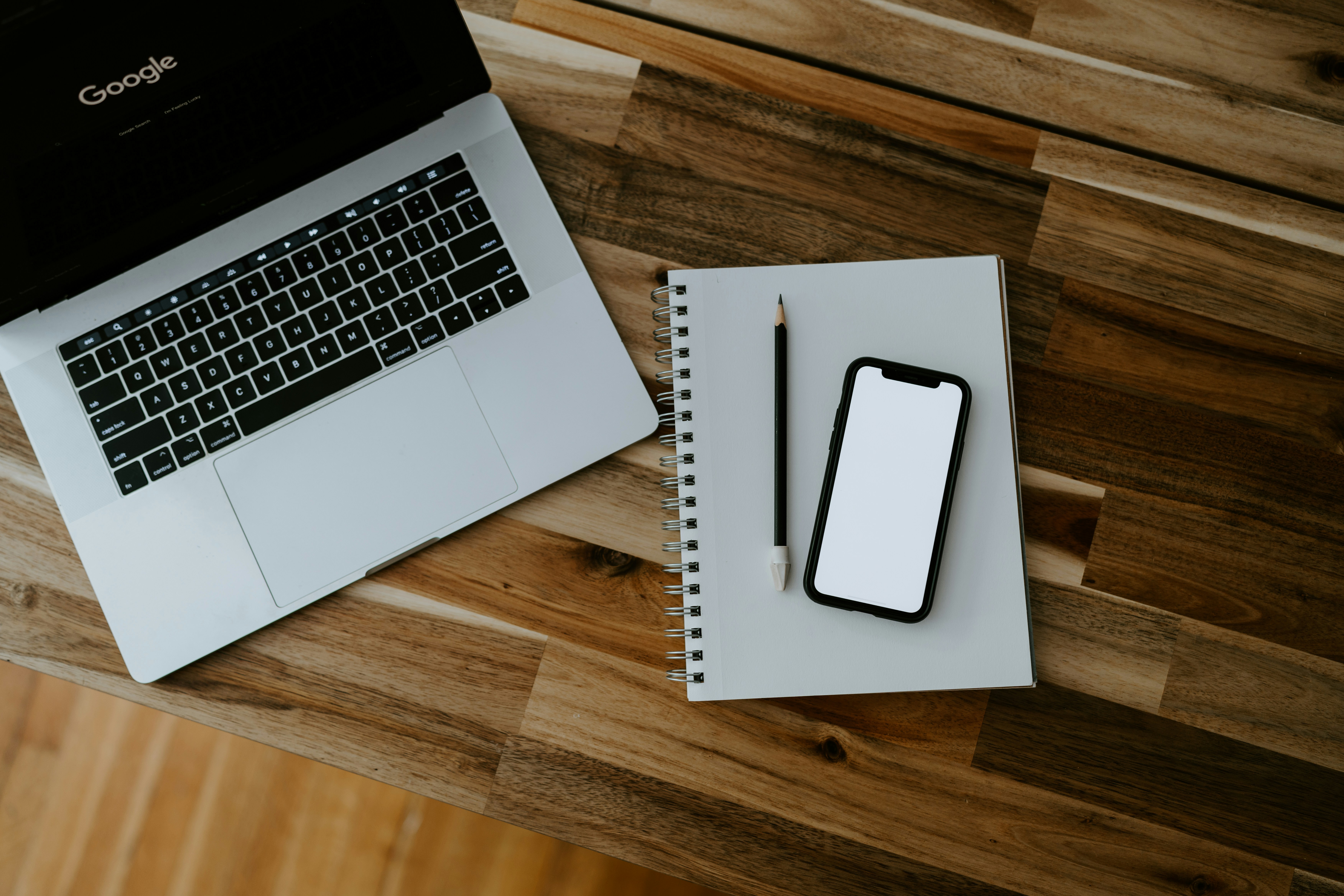 A laptop and a tablet on a table photo – Free Wood Image on Unsplash