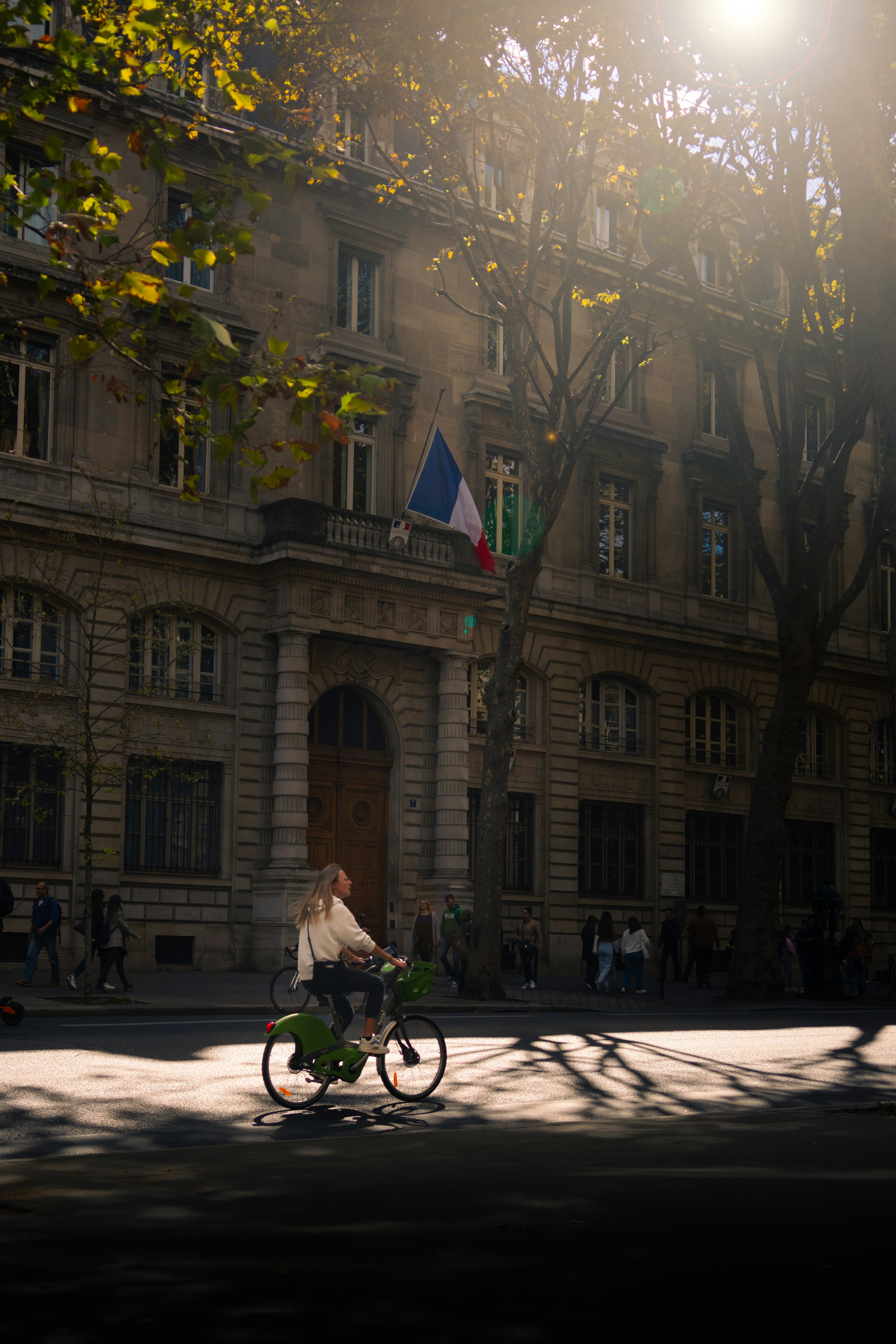 Sunlit Rider in a Parisian Courtyard