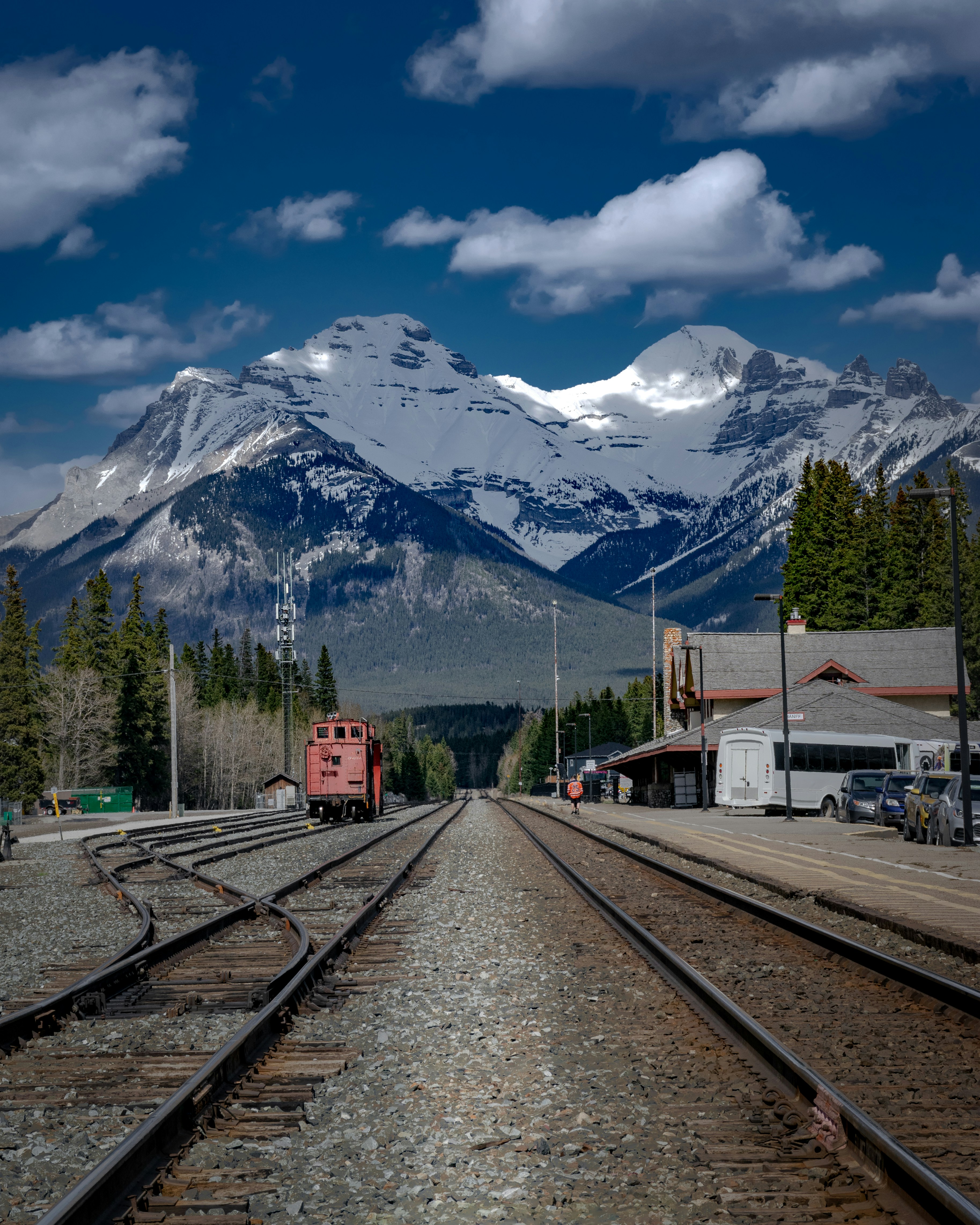 Train tracks with a snowy mountain in the background photo – Free Banff ...