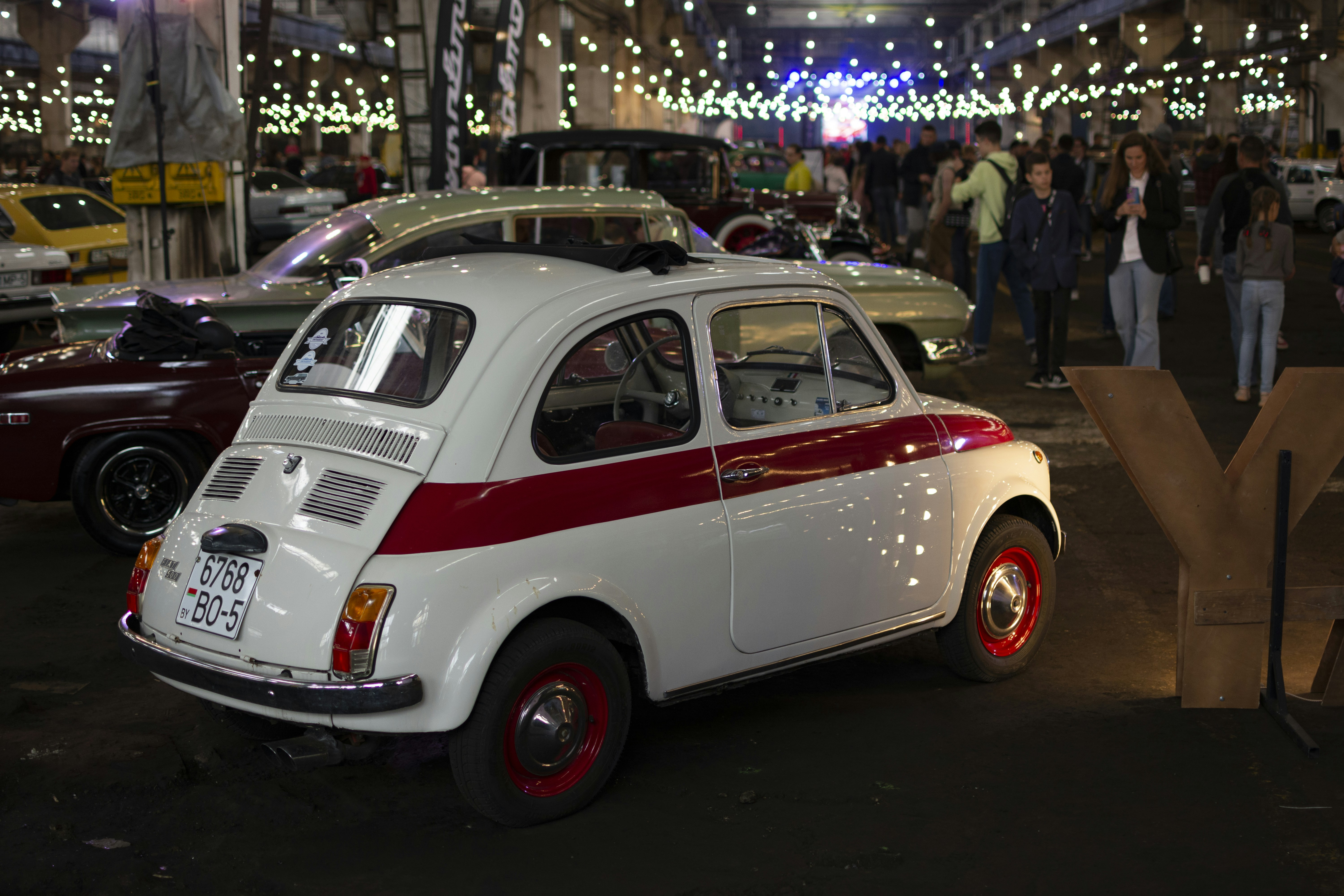 Fiat 500 Revival: White with a Crimson Band at a Lantern-lit Car Show